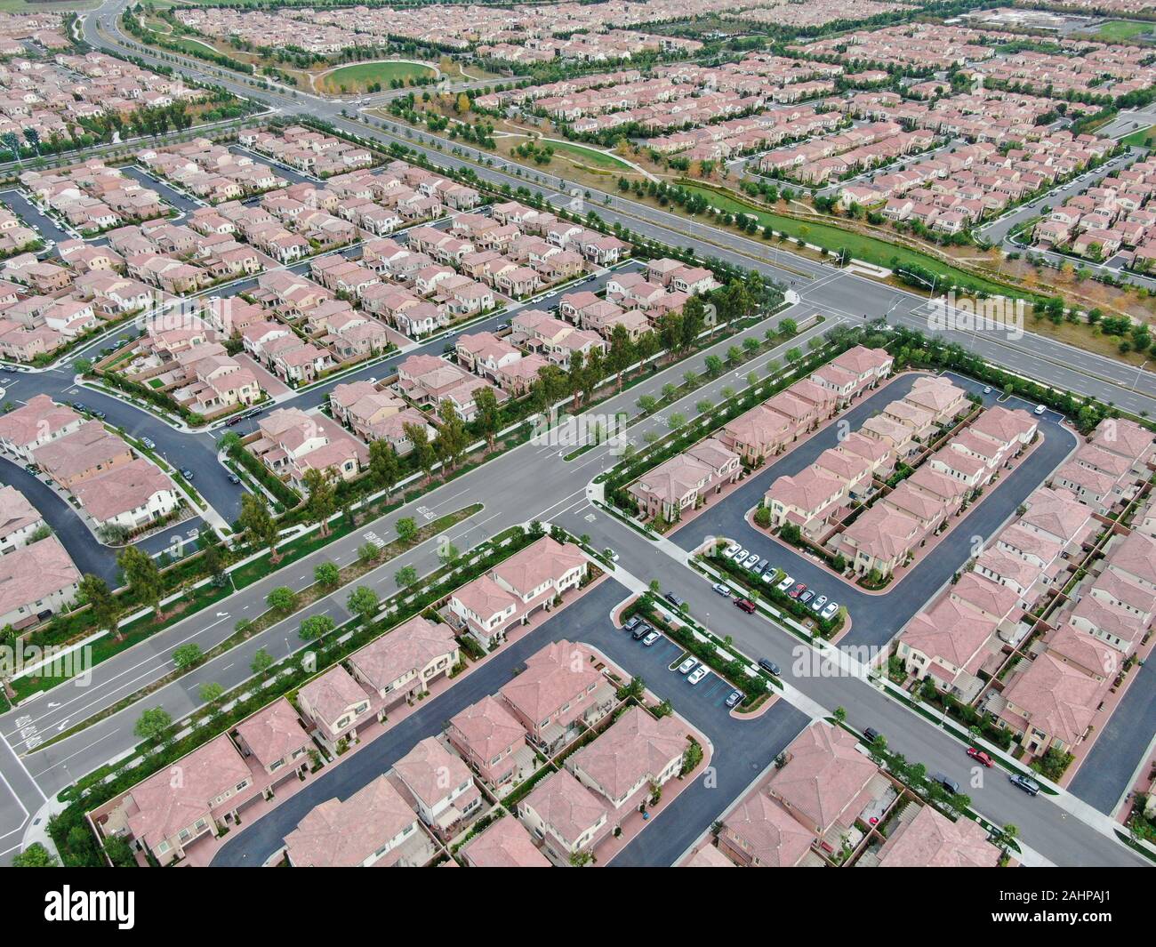 Aerial view of urban sprawl. Suburban packed homes neighborhood with ...