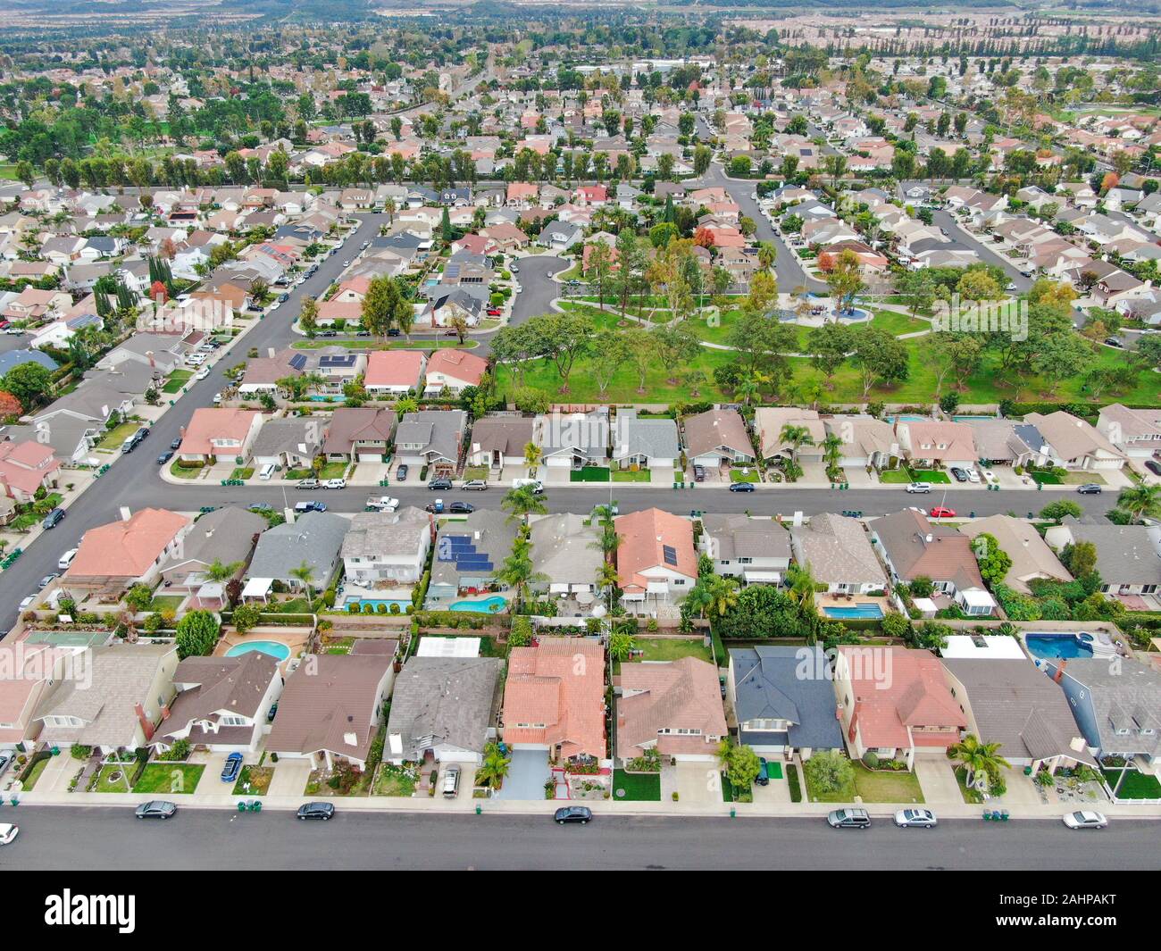 Aerial view of urban sprawl. Suburban packed homes neighborhood with ...