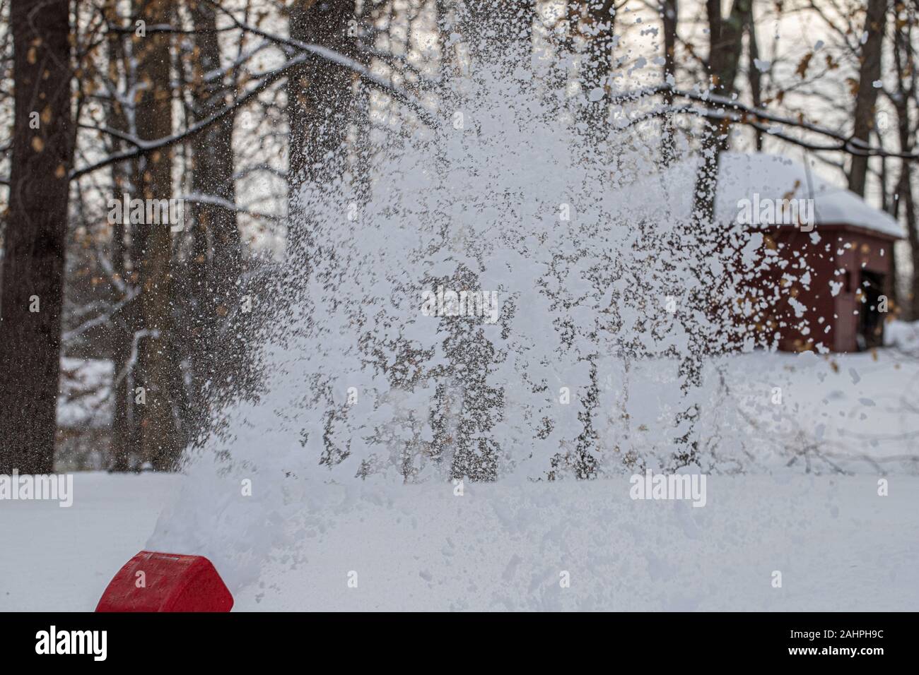 Man pushing snow blower during storm Stock Photo - Alamy