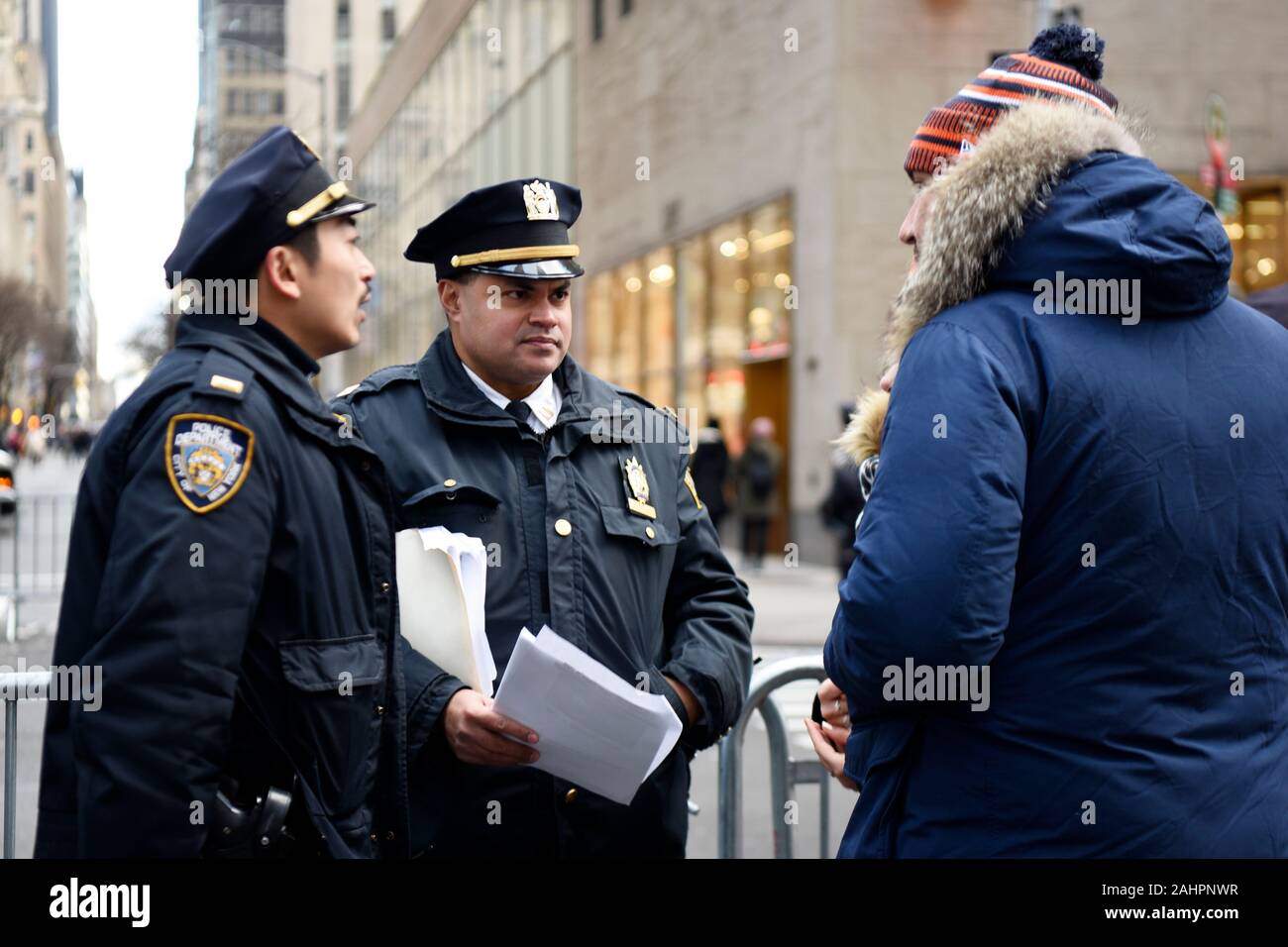 New York, USA. 31st Dec, 2019. Police officers talk with a visitor ...