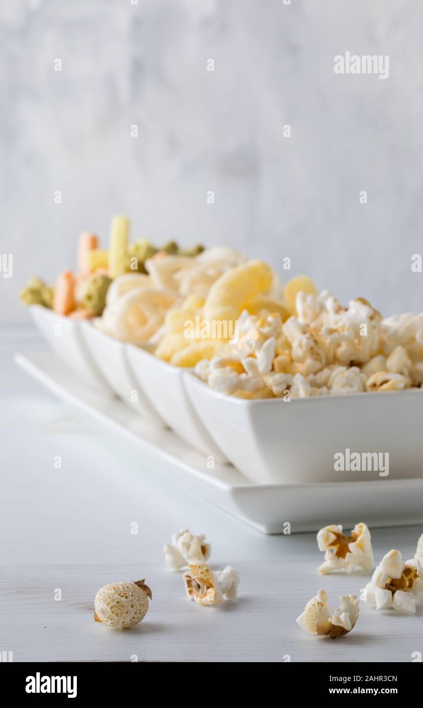 A close up of a row of small white dishes filled with a variety of ...