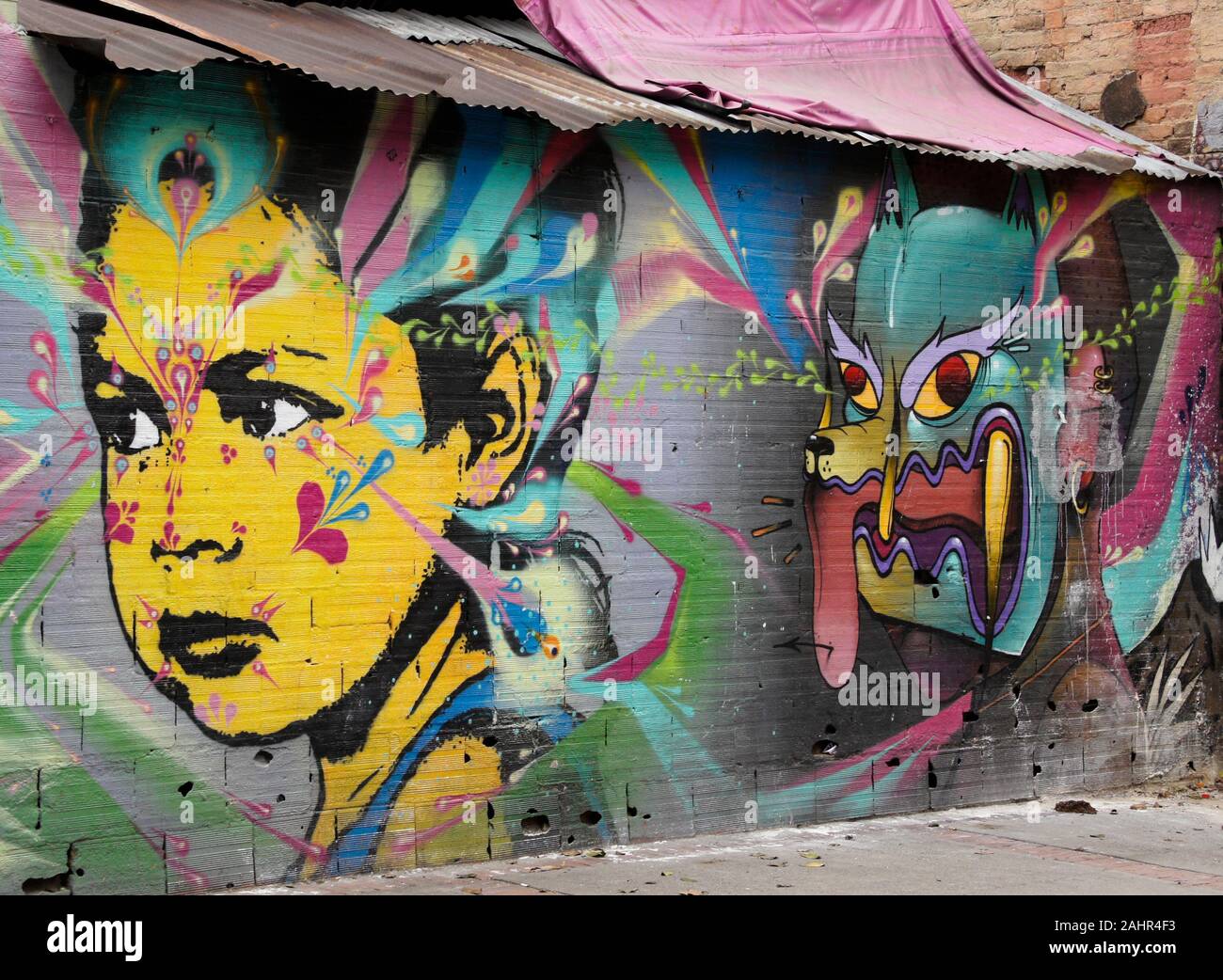 Street art painted on exterior of building in La Candelaria district of ...