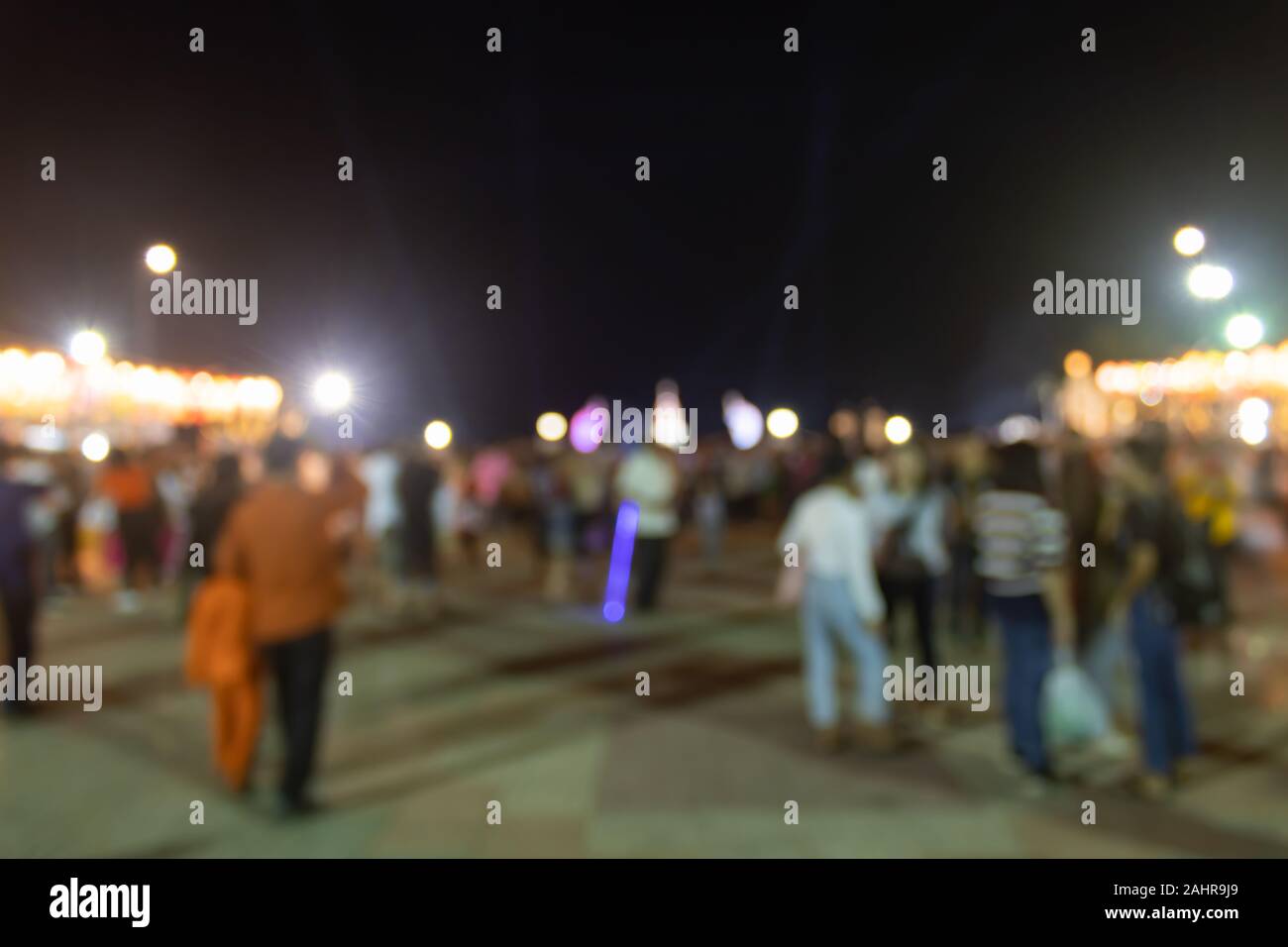 Blurred Crowd and Light in Night Scene. Crowd blurred focus in standing ...
