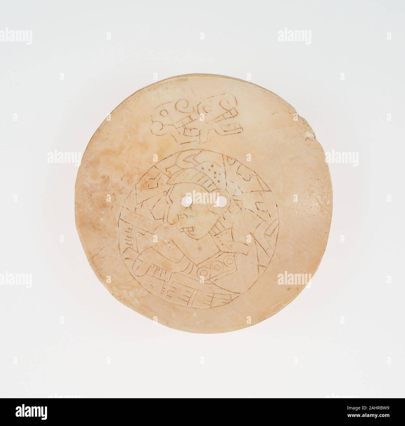 Huastec. Disc from an Earflare Inscied with a Figure in Contoured Pose ...