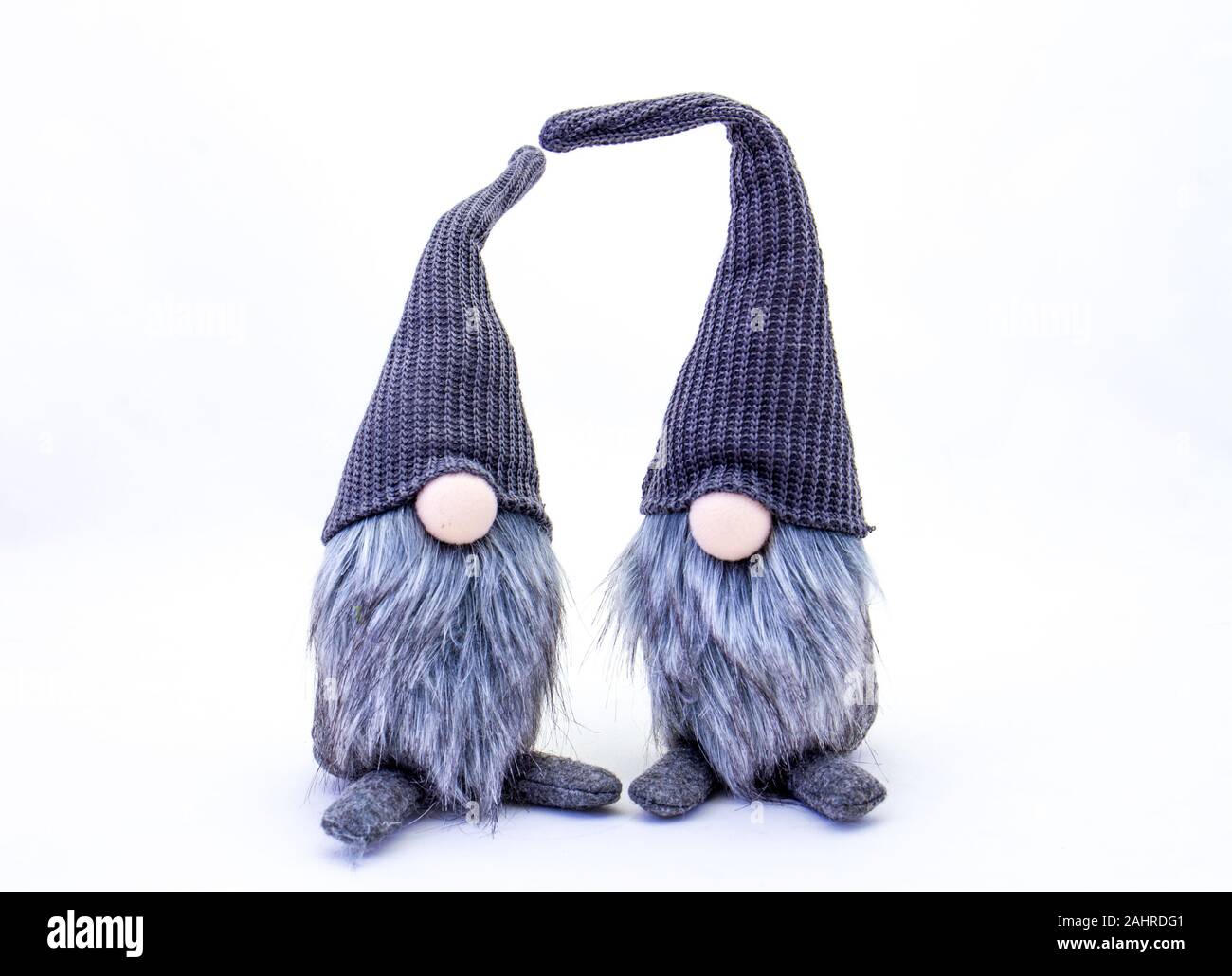 Two hairy grey gnomes with pink noses and large hats isolated on a ...