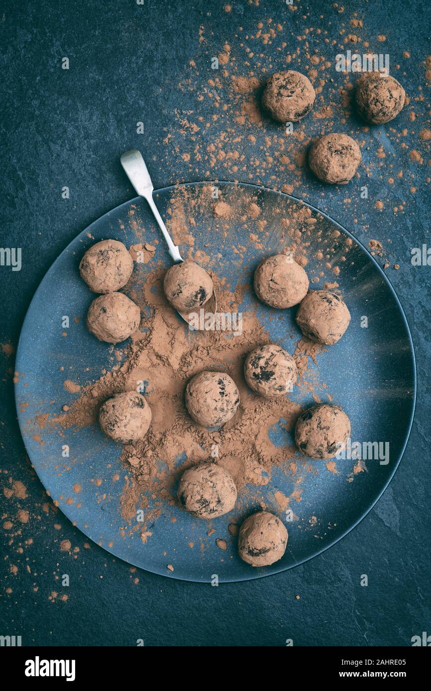 Homemade vegan cacao date cranberry and nut energy balls covered in ...