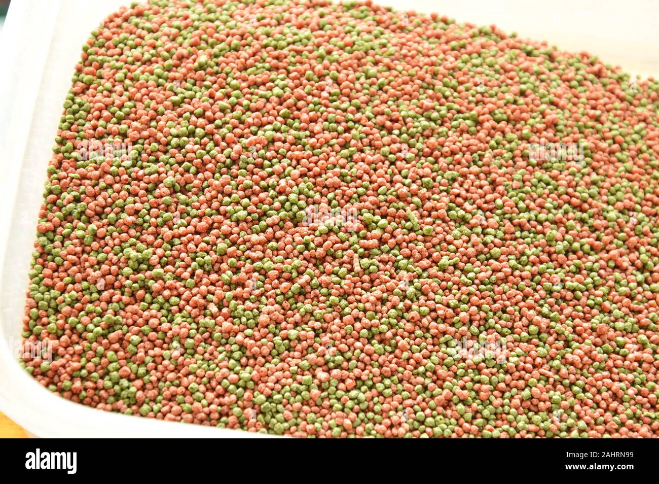 close up of fish food grain texture and background Stock Photo - Alamy