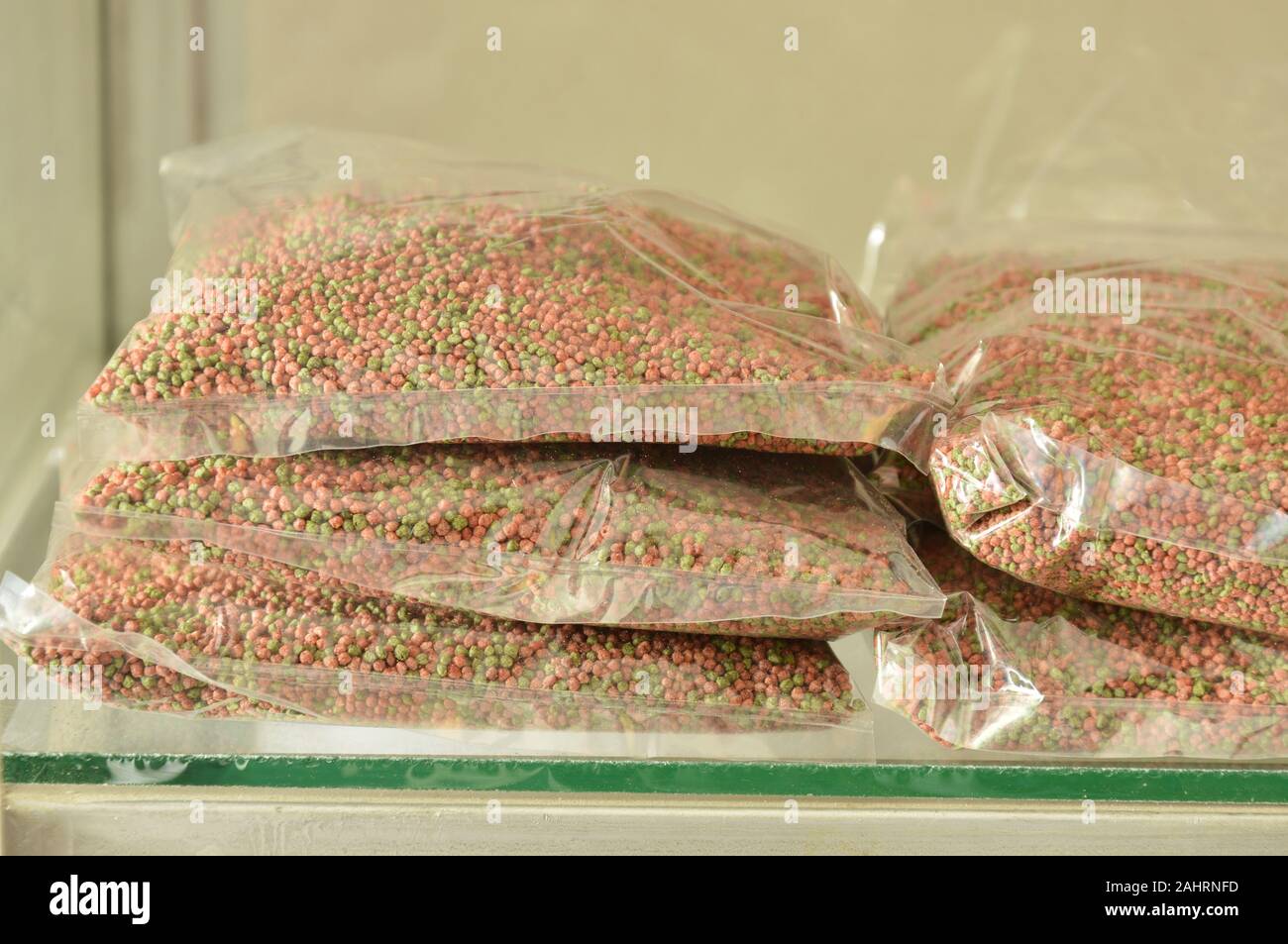 fish food with plastic bag packing for sale in pet shop Stock Photo - Alamy