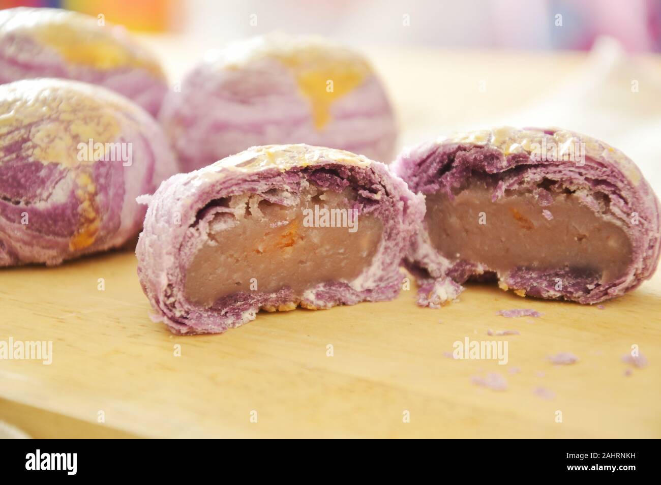 Chinese cake stuffed mush sweet taro and bean on wooden chop block ...