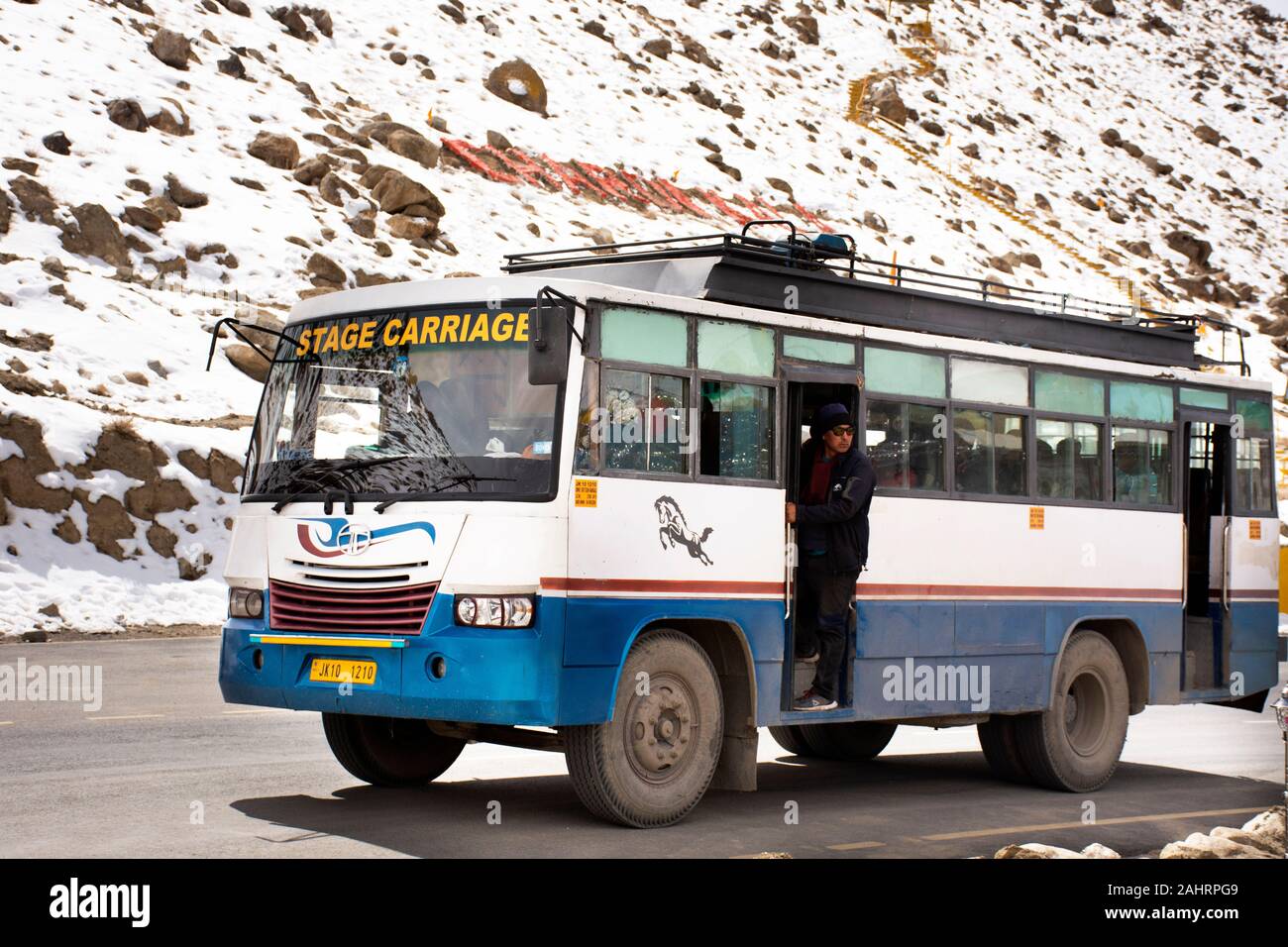 JAMMU KASHMIR, INDIA - MARCH 20 : Indian people driver driving bus send ...