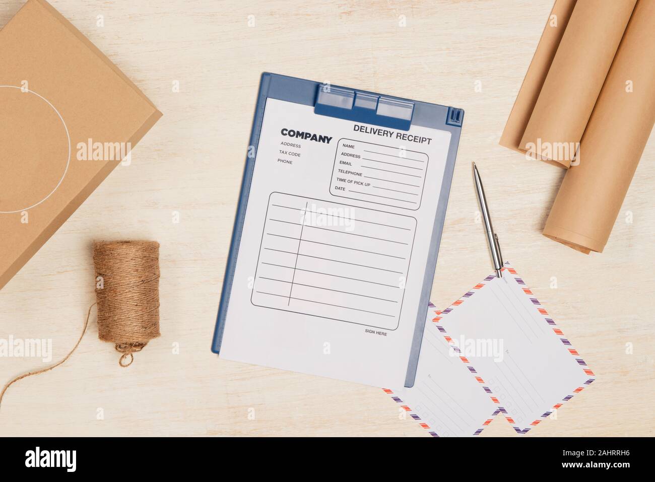 Postal parcels and envelopes and a form for filling with a pen on a ...