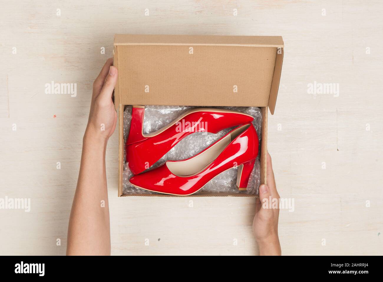 Female hands shoes box hi-res stock photography and images - Alamy