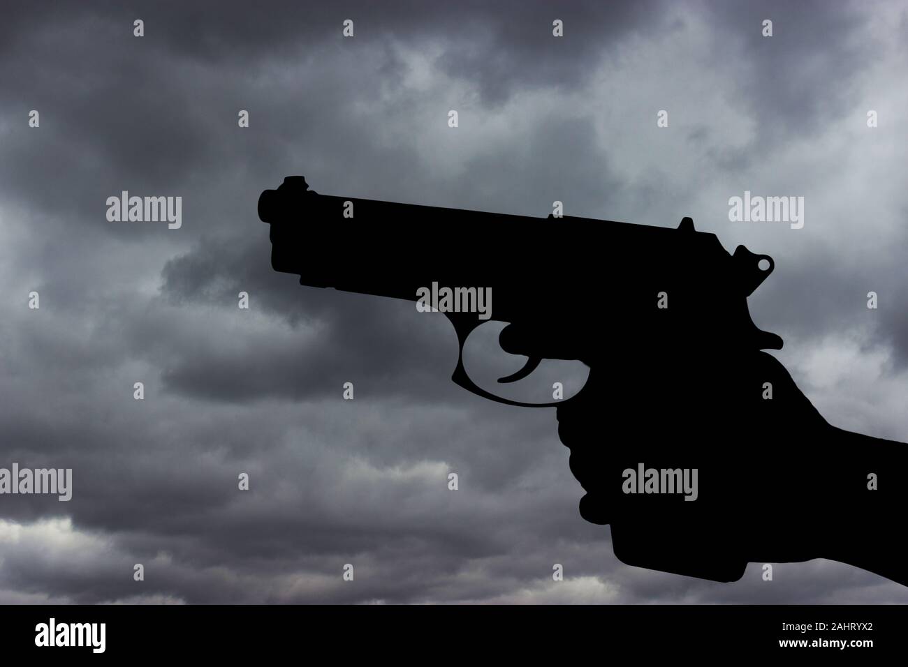 Gun in hand. Close up Stock Photo - Alamy