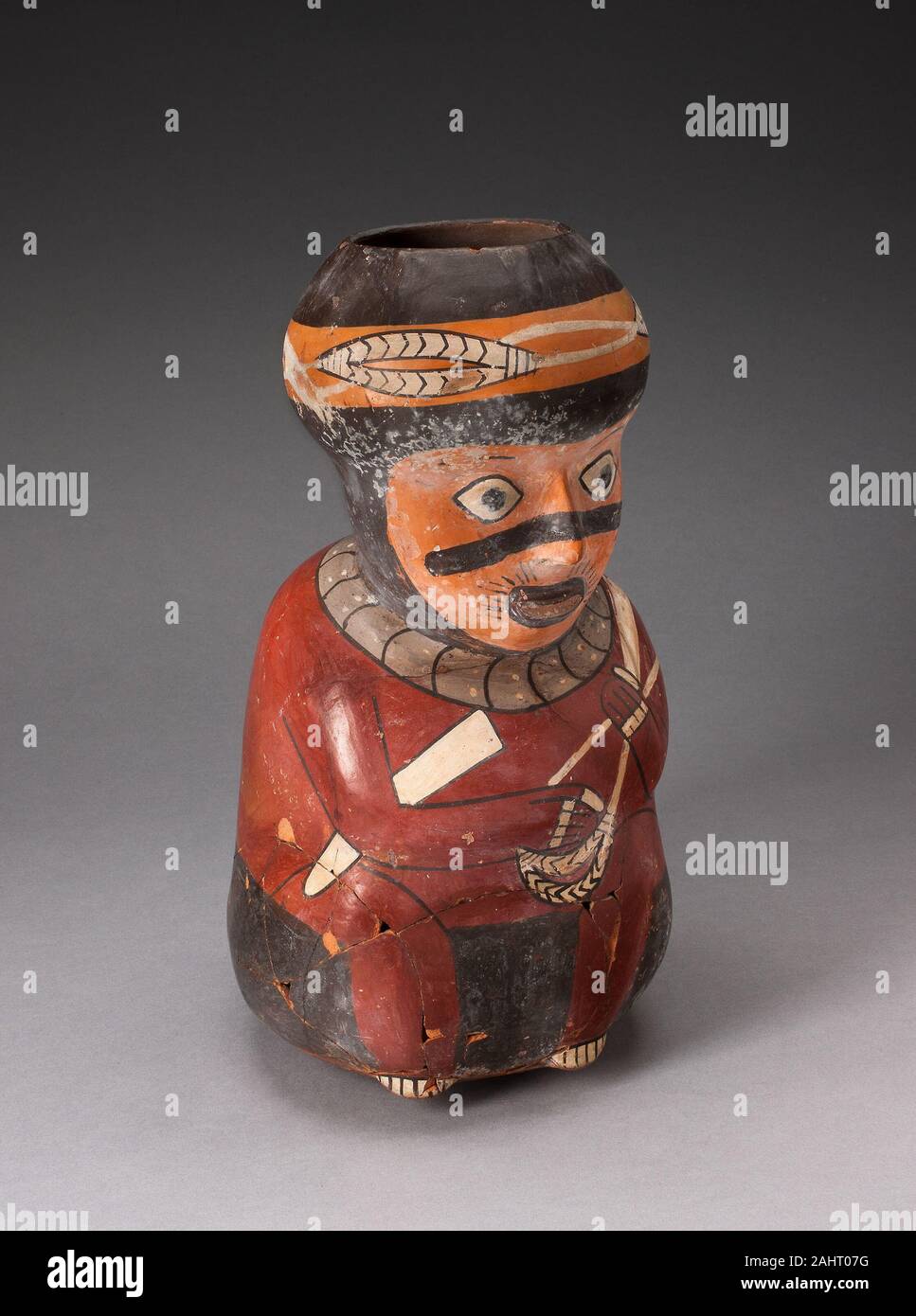 Nazca. Jar in the Form of a Seated Warrior Holding a Sling and Club ...