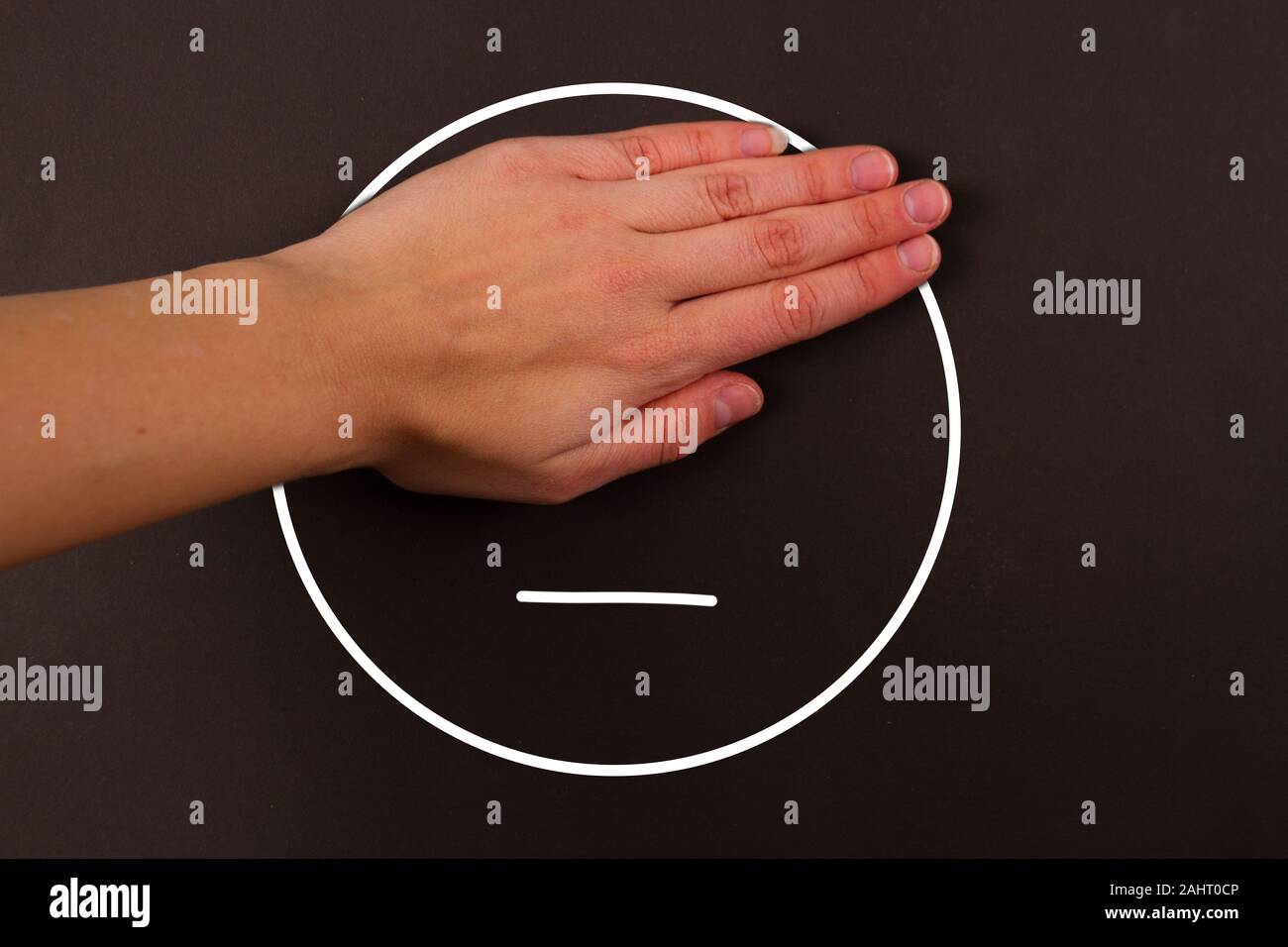 Hand shut eyes of unhappy smiley Stock Photo - Alamy