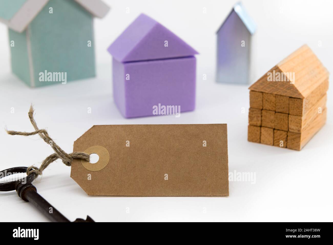 Blank label on a key, model houses in the background Stock Photo - Alamy