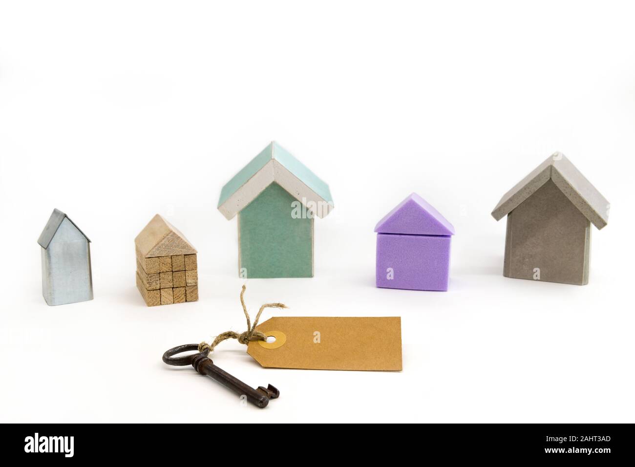 Blank label on a key, model houses in the background Stock Photo - Alamy