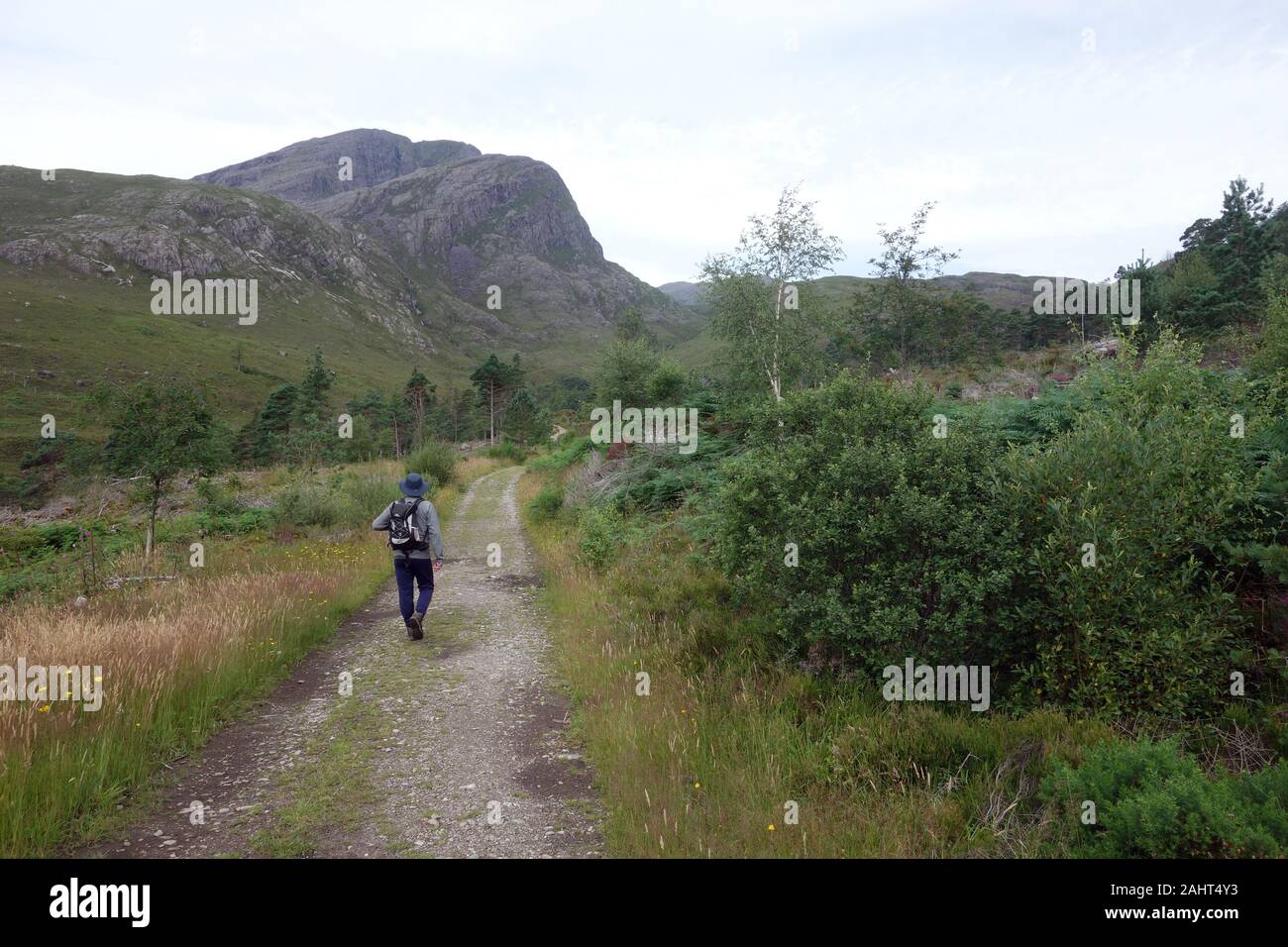 Lone Man Walking Towards the Scottish Mountain Corbett Fuar Tholl from ...