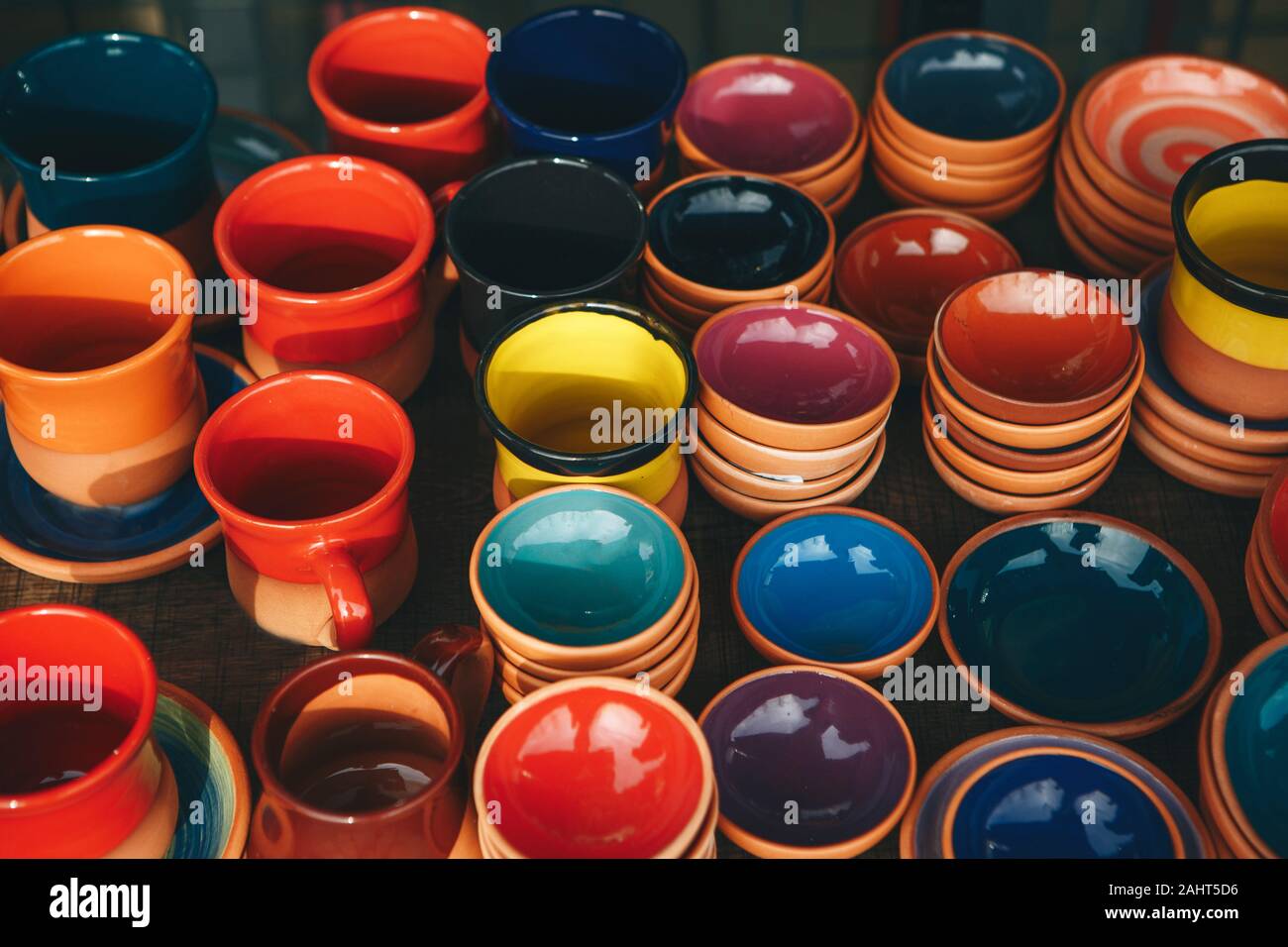 A lot of multi-colored pottery background. Hobbies or traditional ...