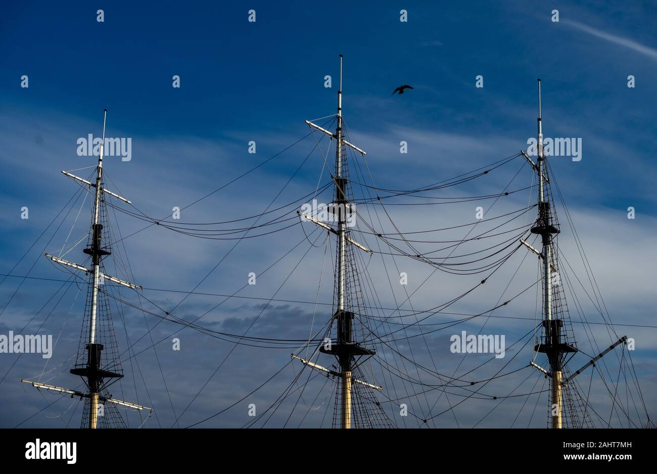 Masts of a ship without sails against the blue sky Stock Photo - Alamy