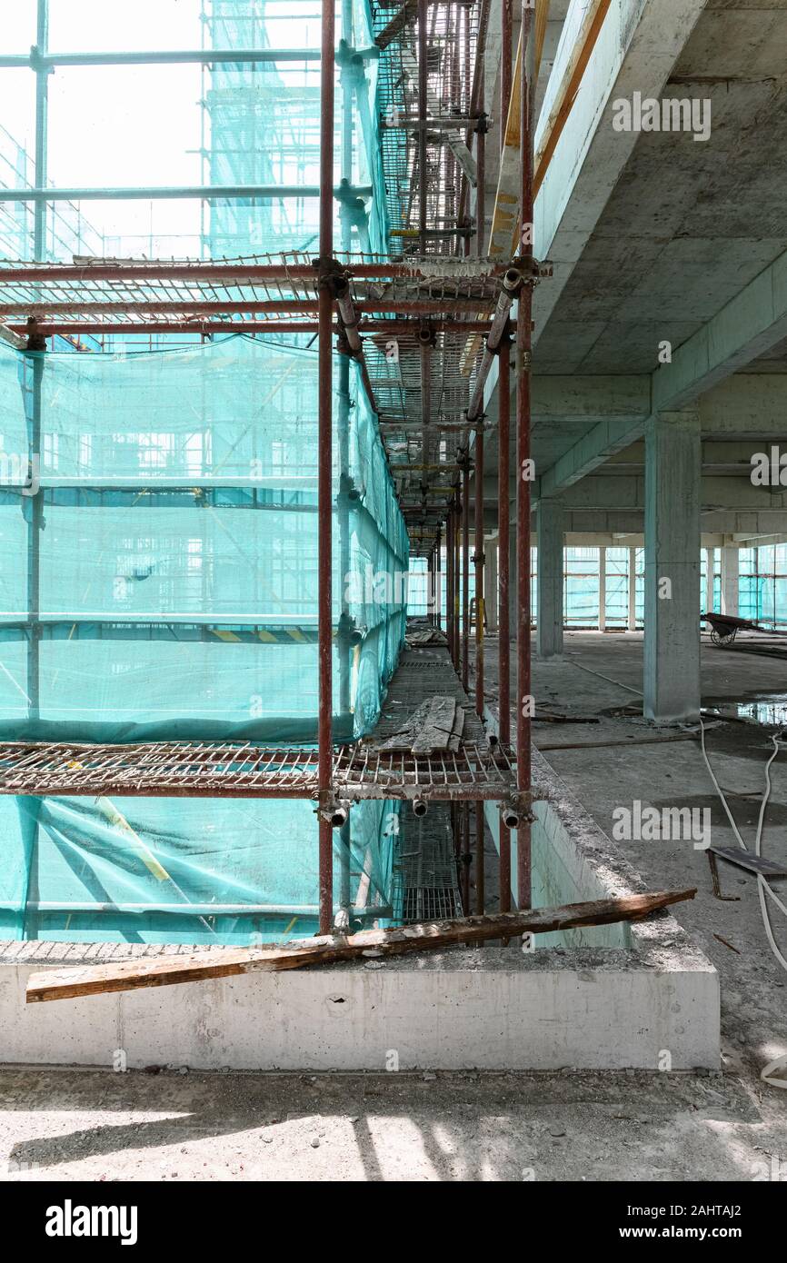 inside of an unfinished building with protection scaffolding and ...