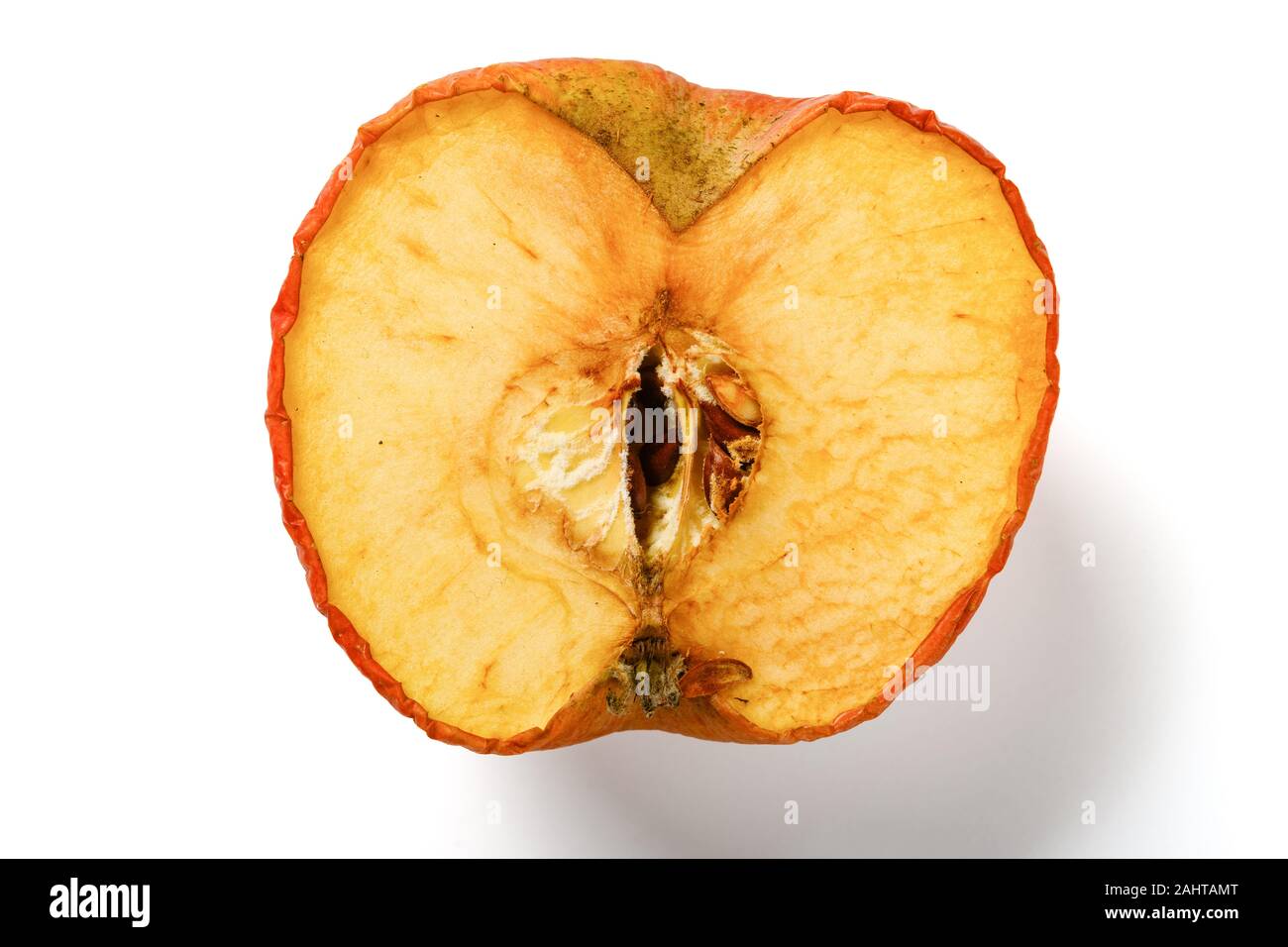 cut out section of an overripe apple on white background Stock Photo ...