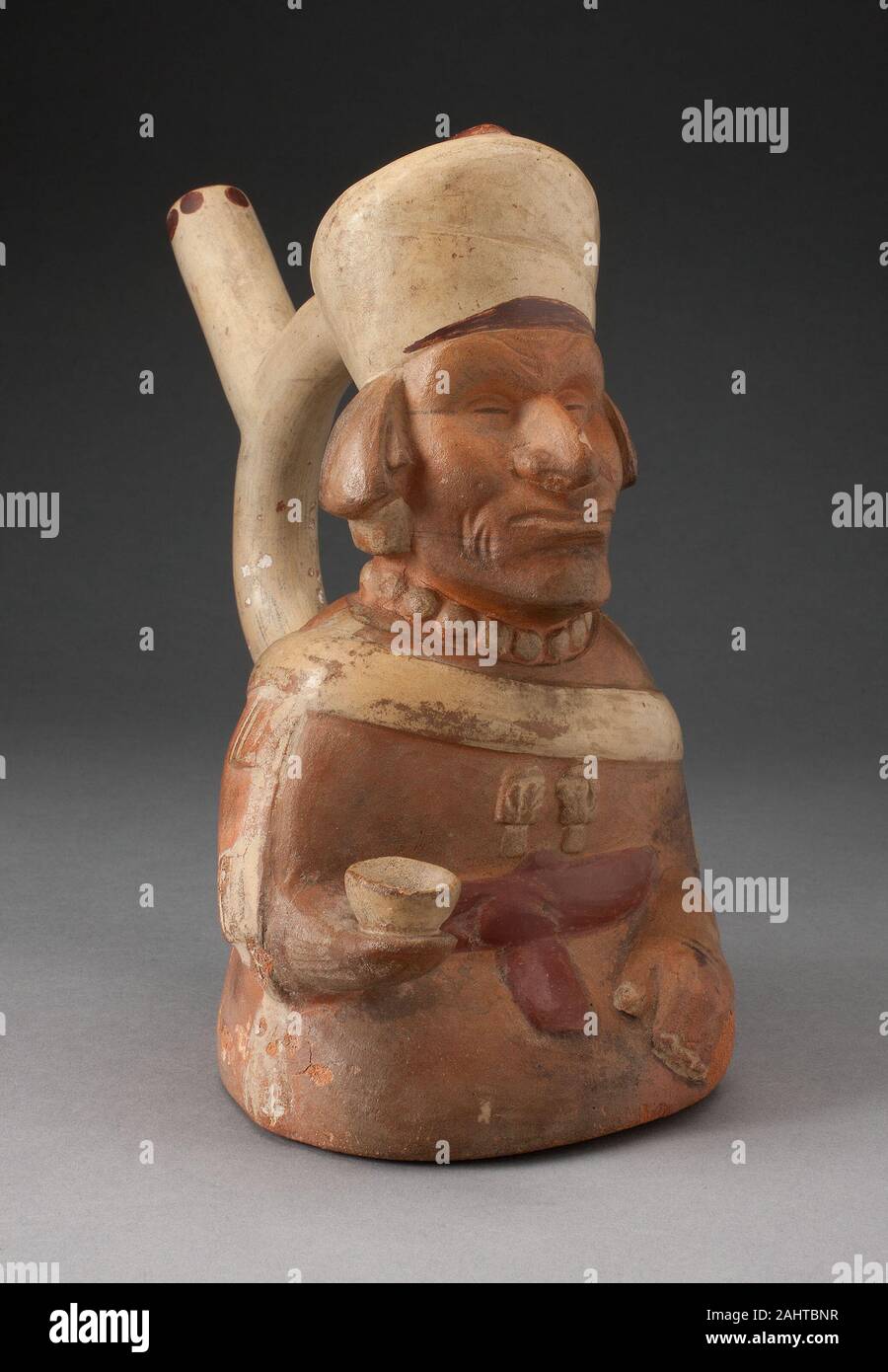 Moche. Handle Spout Vessel in the Form of Blind Man Holding a Cup. 100 ...