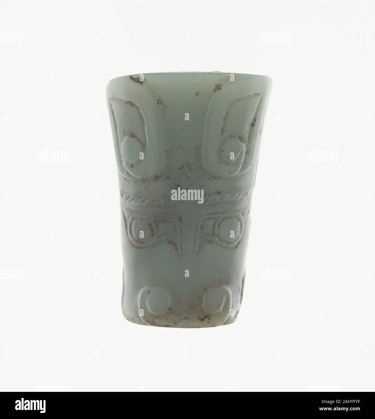 Bead with Animal Mask. 1300 BC–1000 BC. China. Jade Stock Photo - Alamy