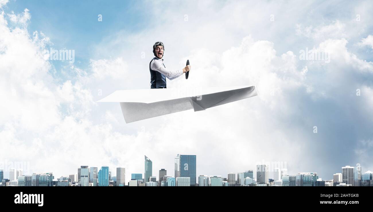 Business leadership and motivation concept with pilot sitting in paper ...