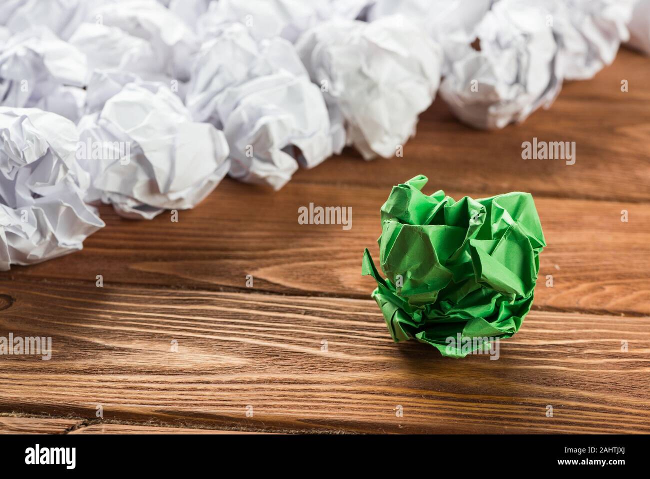 White crumpled up piece of paper on wooden table as idea Stock Photo ...