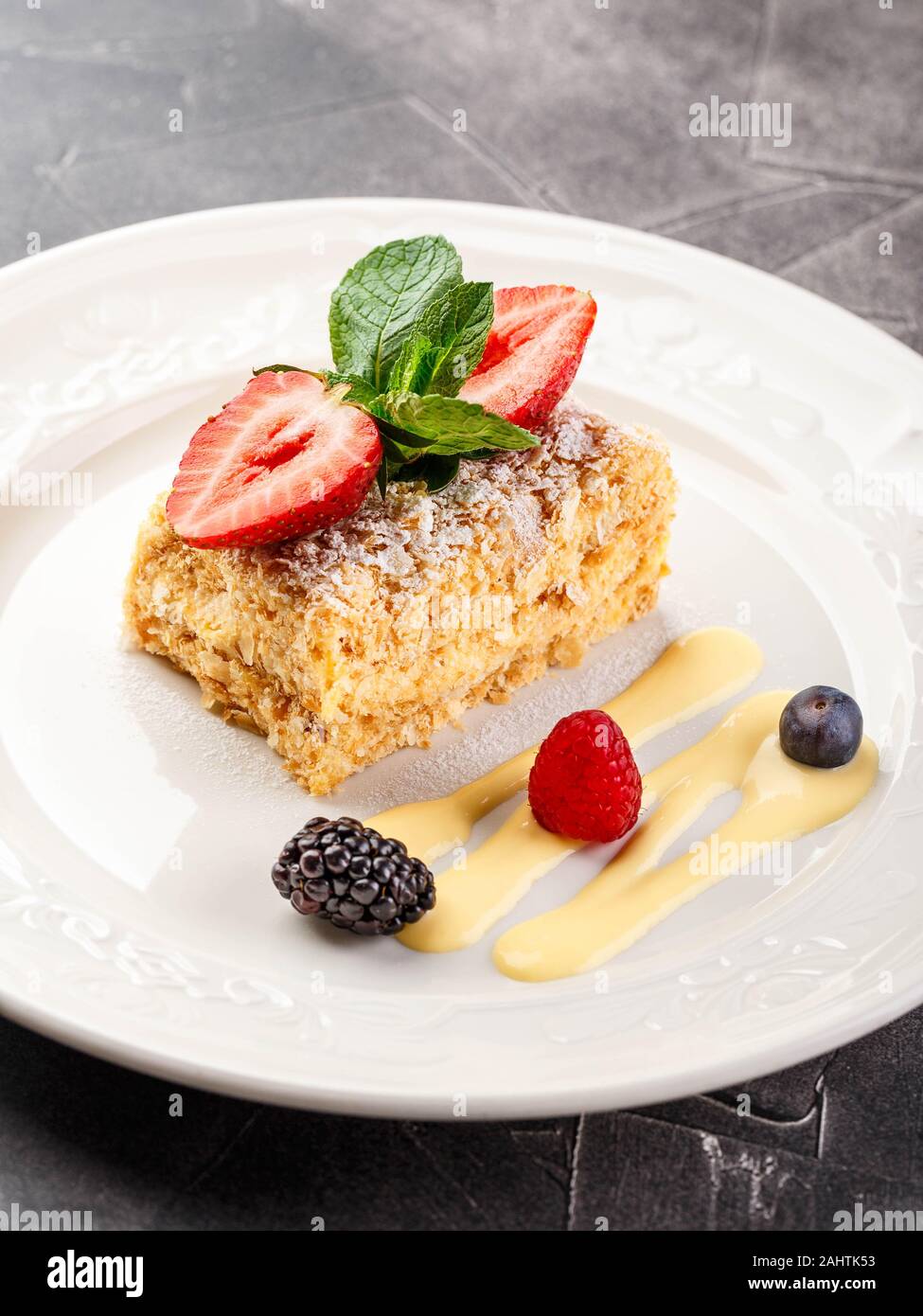 Traditional Napoleon puff cake with vanilla custard and berries ...