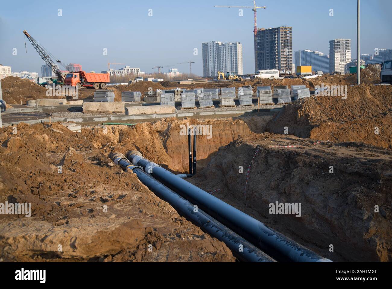 Laying of underground storm sewer pipes. Installation of water main ...