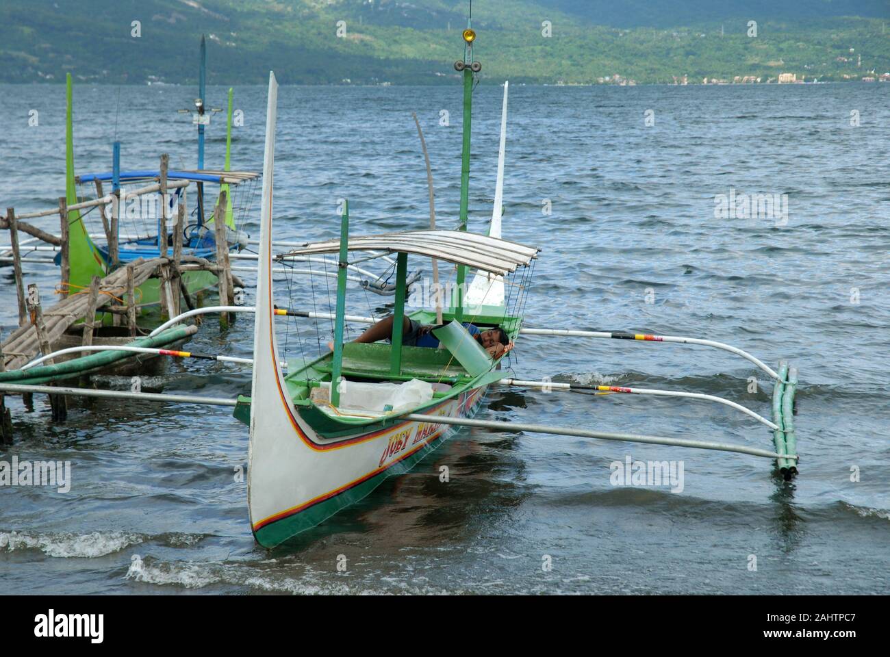 Traditional Bangka boats docked on the shore of Taal Lake on Taal ...