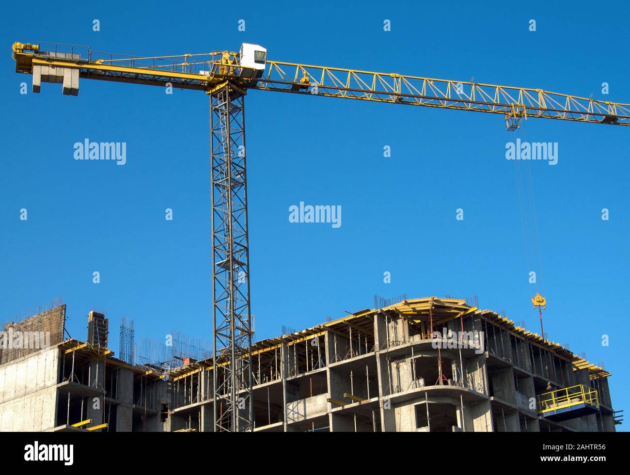 Tower crane lifts the block for building under construction at ...