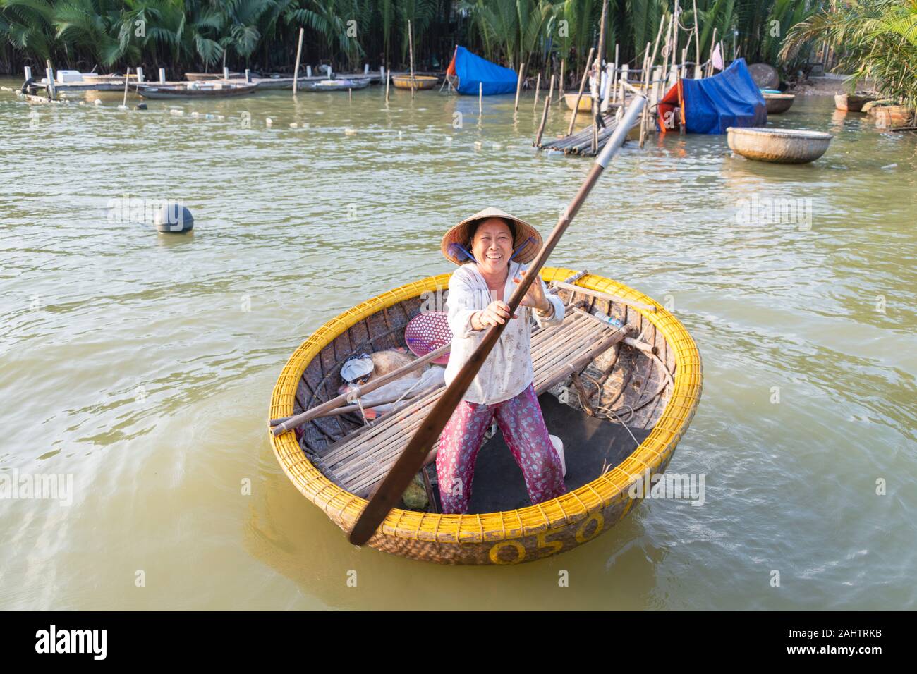 Vietnamese Fisherwoman in coracle bamboo circular boat, Hoi An, Vietnam ...