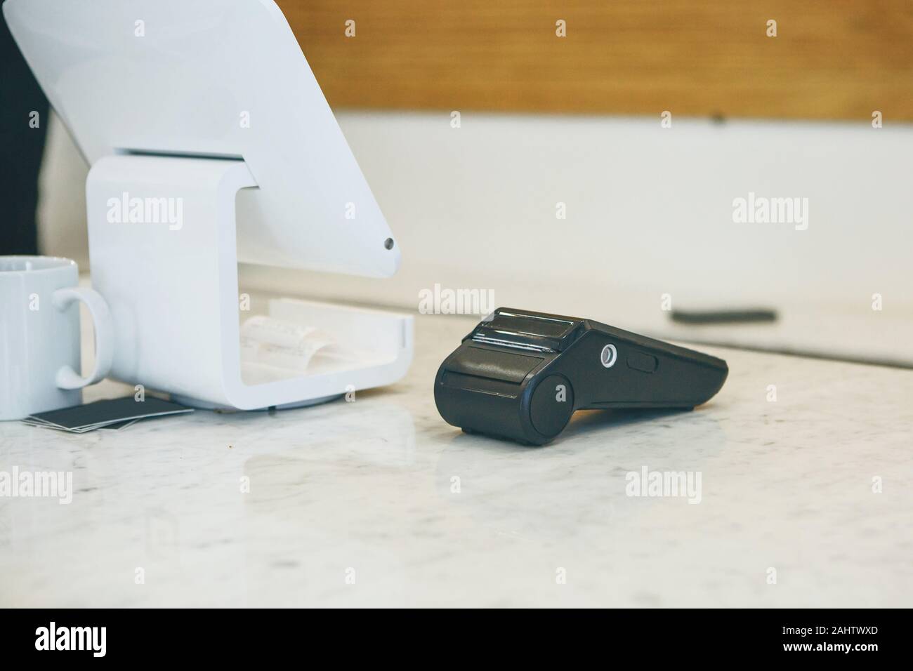 Payment machine and computer on the counter. Cashless payment for goods ...