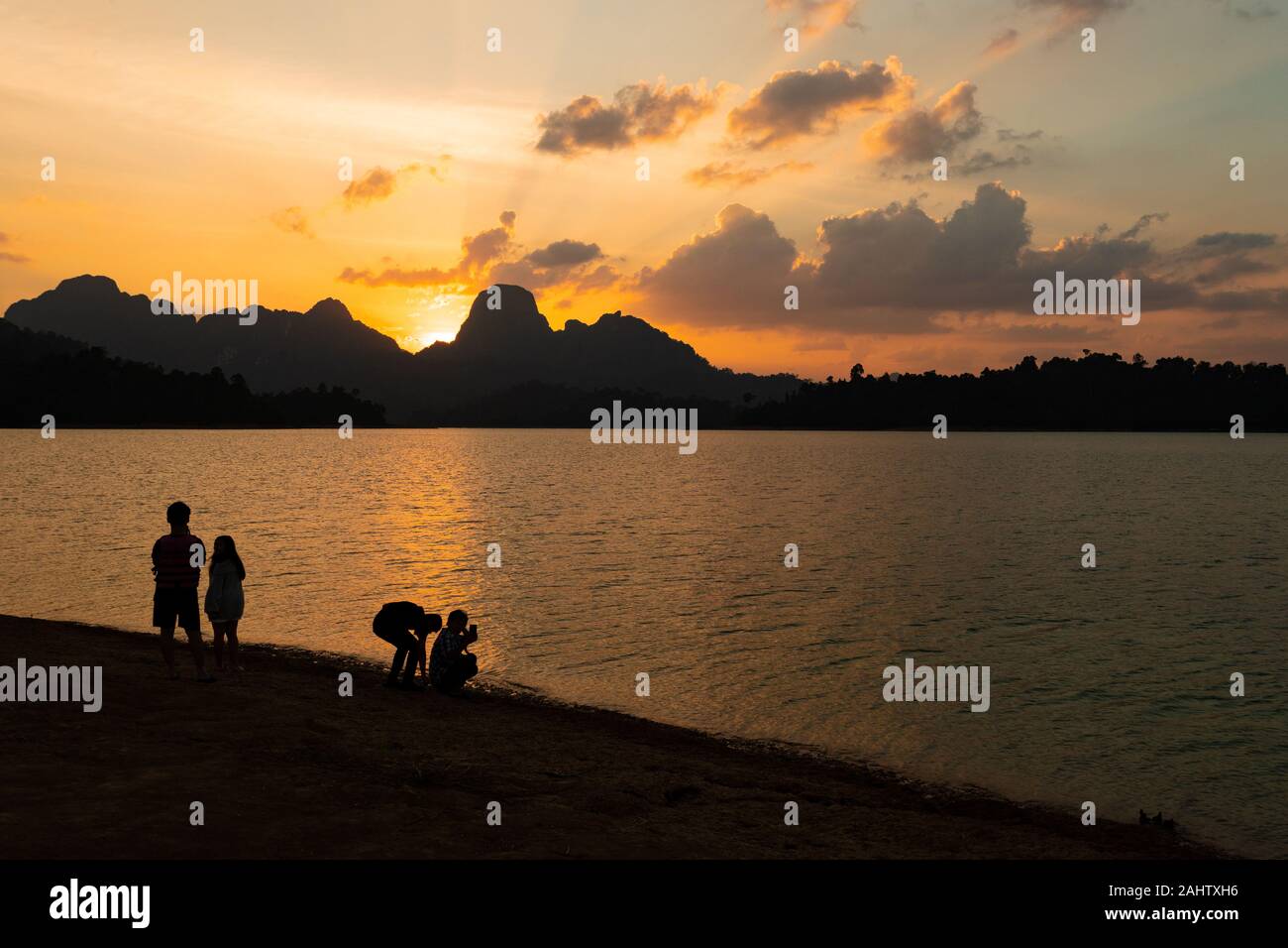 Tourists watching sunset at Ratchaprapa dam, or known as Cheow Lan dam ...