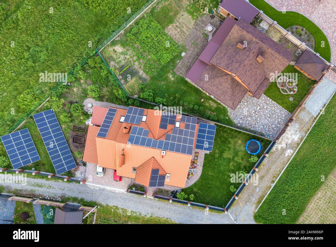 Aerial top view of new modern residential house cottage with blue shiny ...