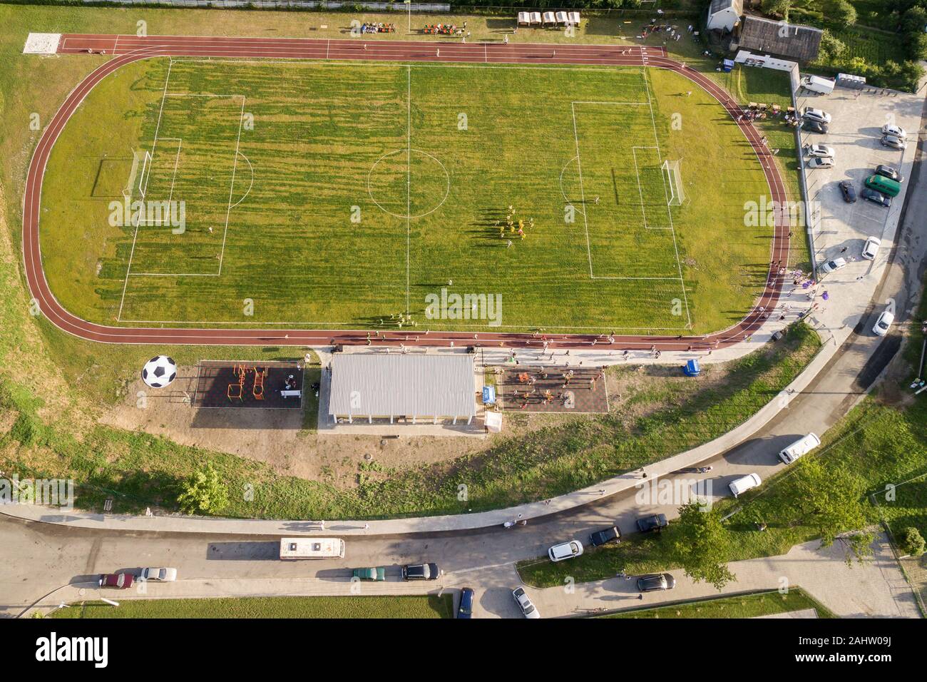 Aerial view of a football field on a stadium covered with green grass ...