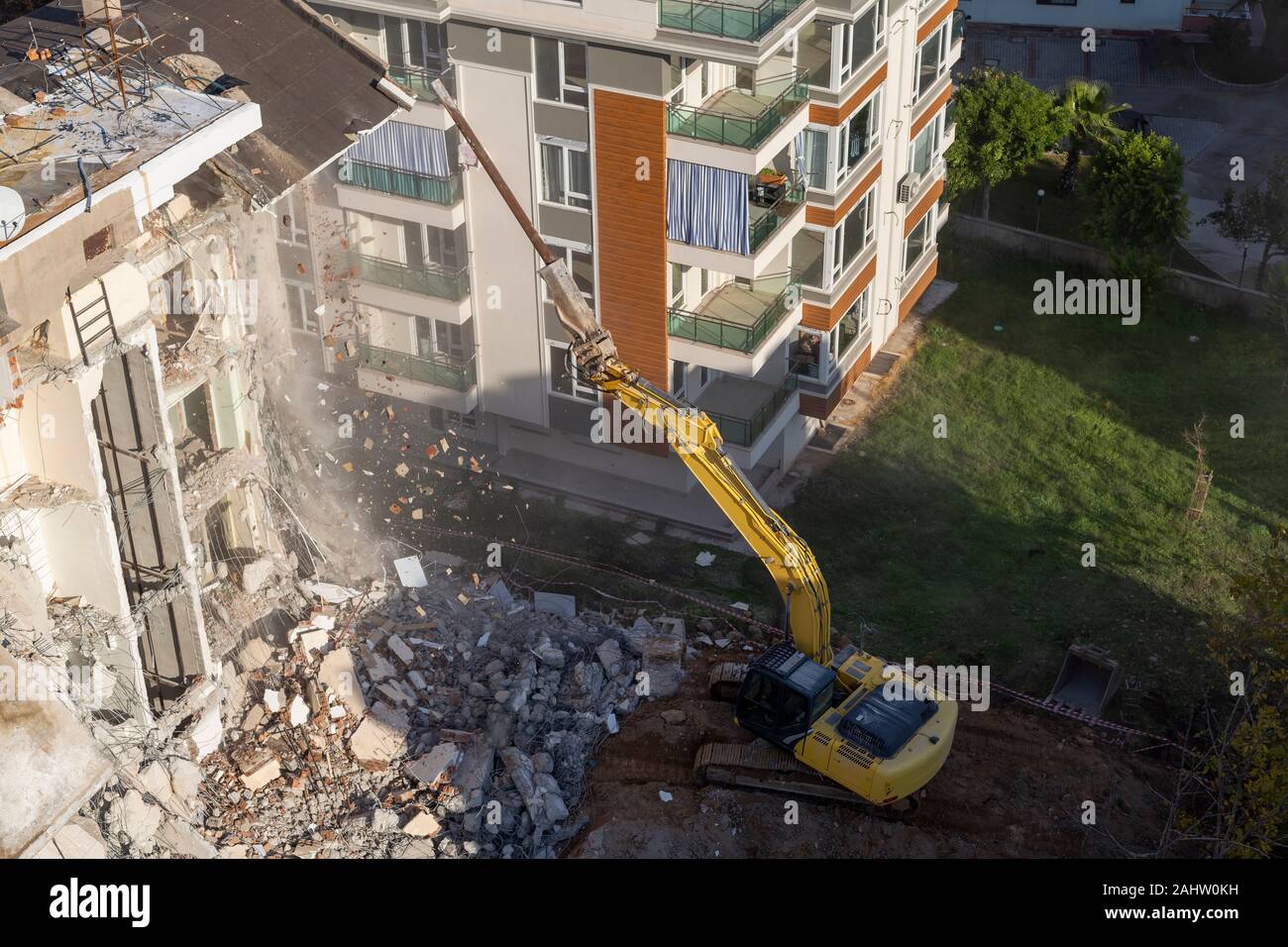When the work machine was tearing down an apartment building Stock ...