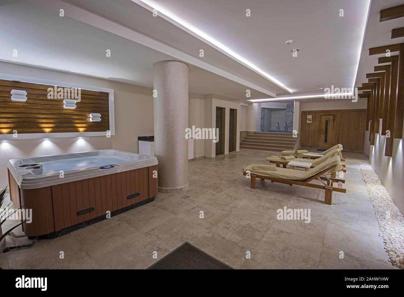 Beds and jacuzzi in a private VIP area of luxury health spa with sauna ...