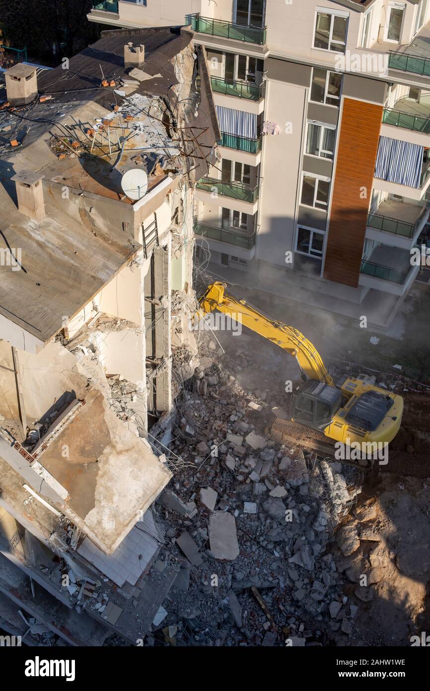 Heavy excavator tearing down old hi-res stock photography and images ...