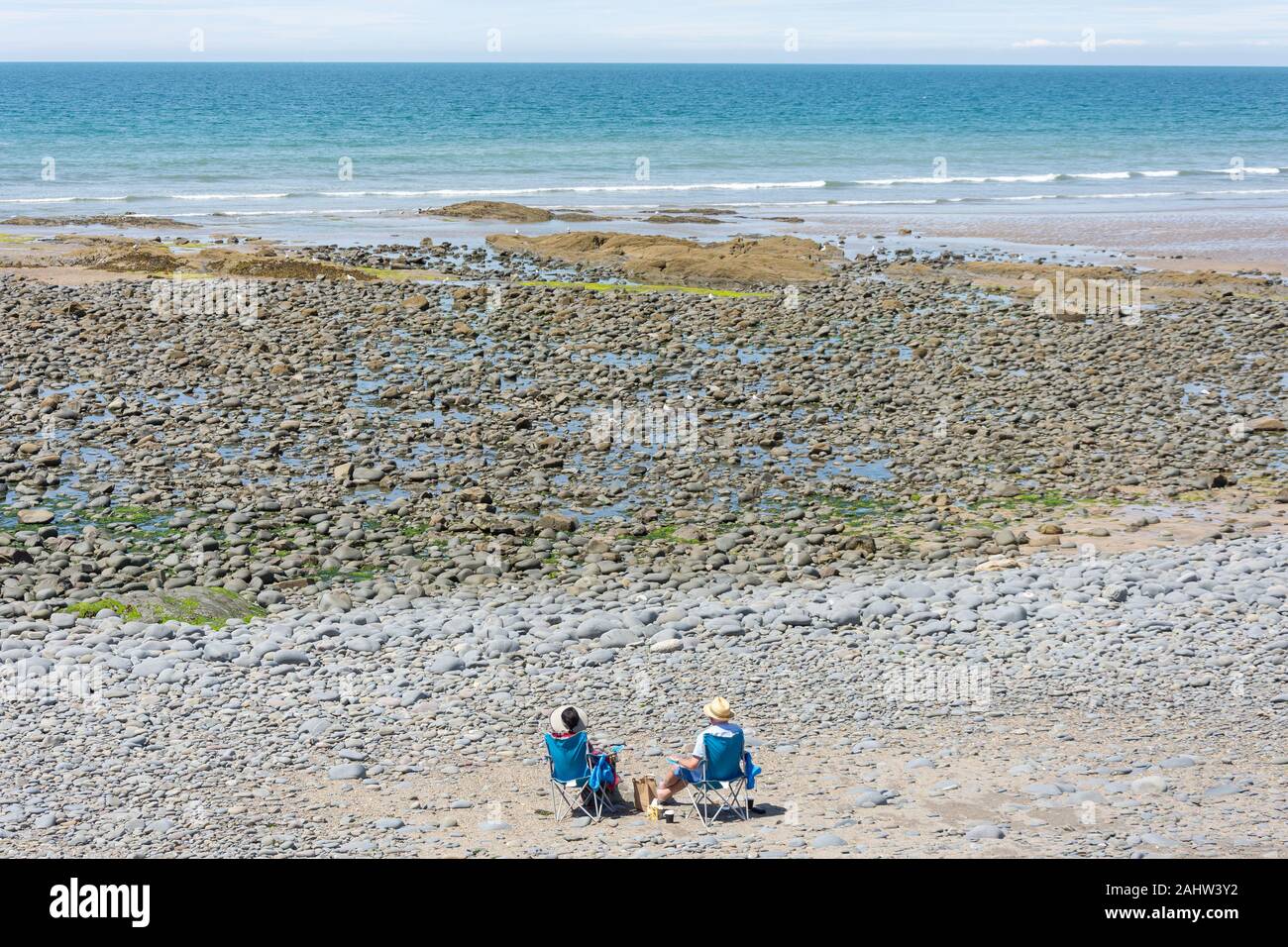 Couple peebles stone beaches beach seafront beachfront promenade hi-res ...