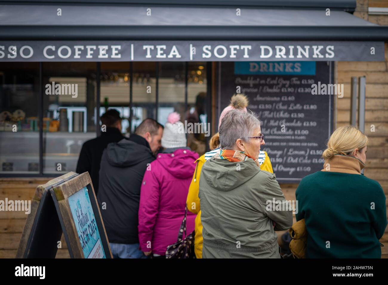 People Queuing at the window of a coffee shop Stock Photo - Alamy