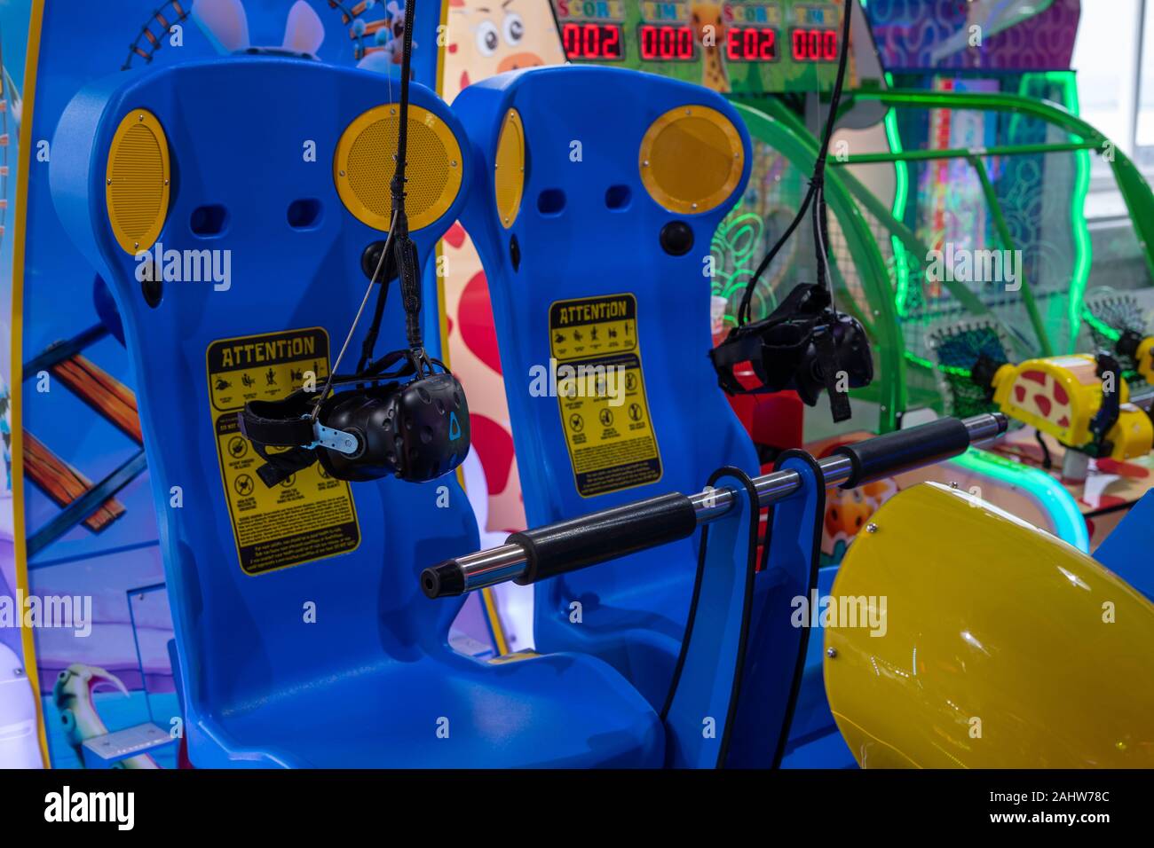 Virtual reality headsets or VR Headsets on an arcade game in an ...