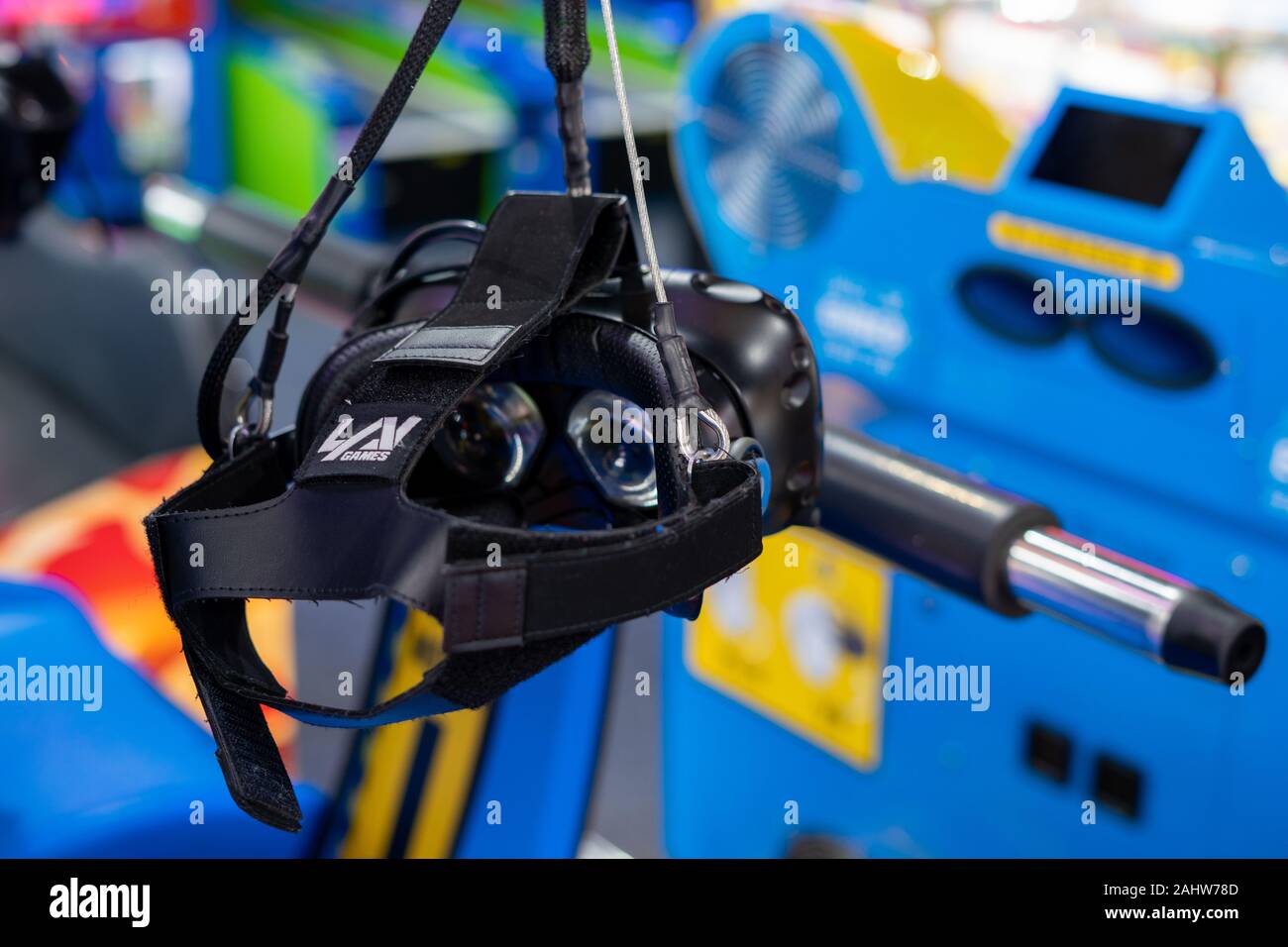 Virtual reality headsets or VR Headsets on an arcade game in an ...