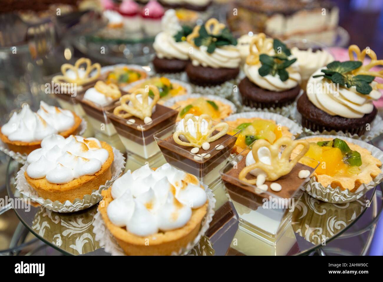 Delicious cream cakes of different kinds close-up Stock Photo - Alamy