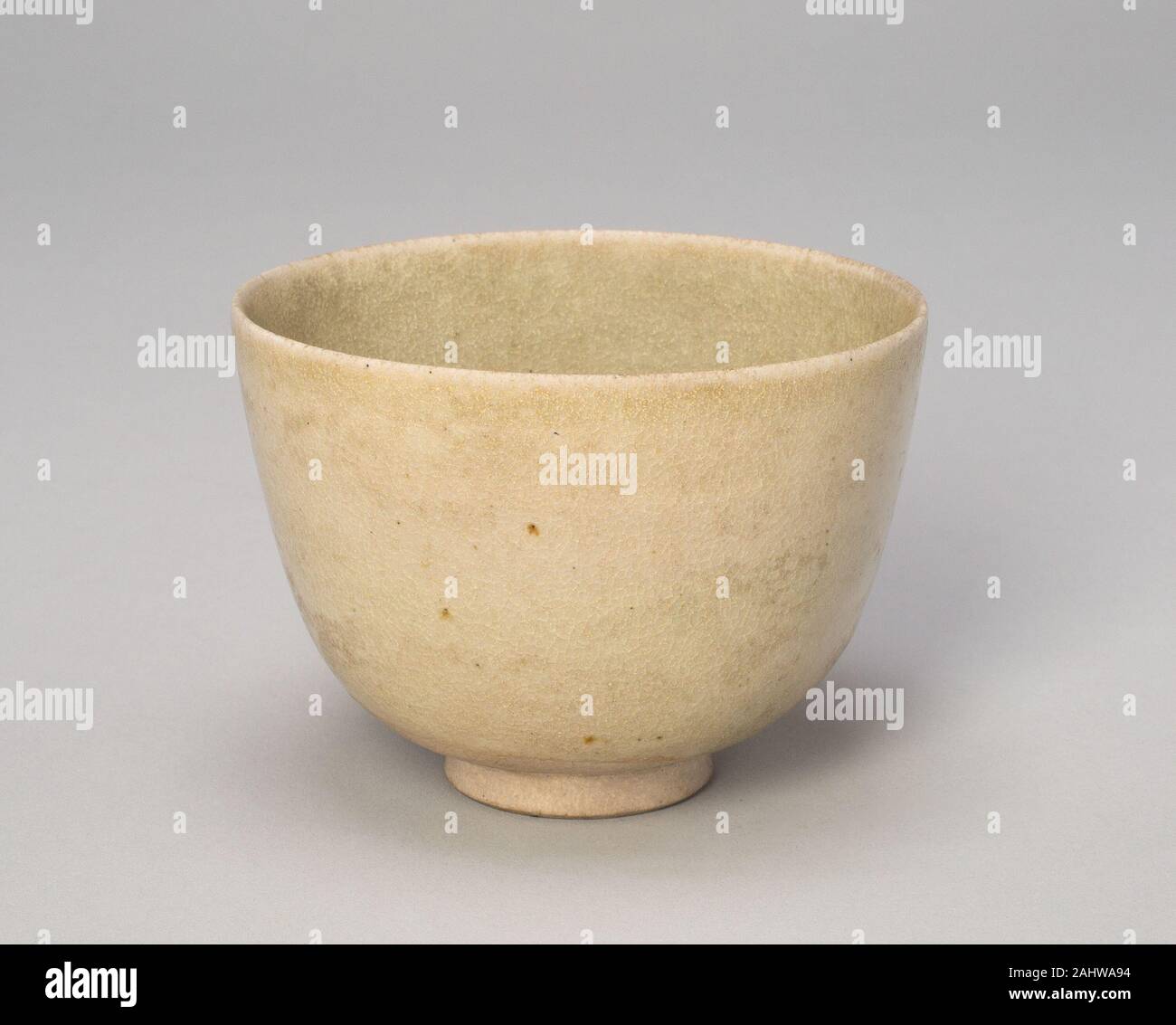 Cup. 581 AD–618 AD. China. Stoneware with cream-colored glaze Stock ...