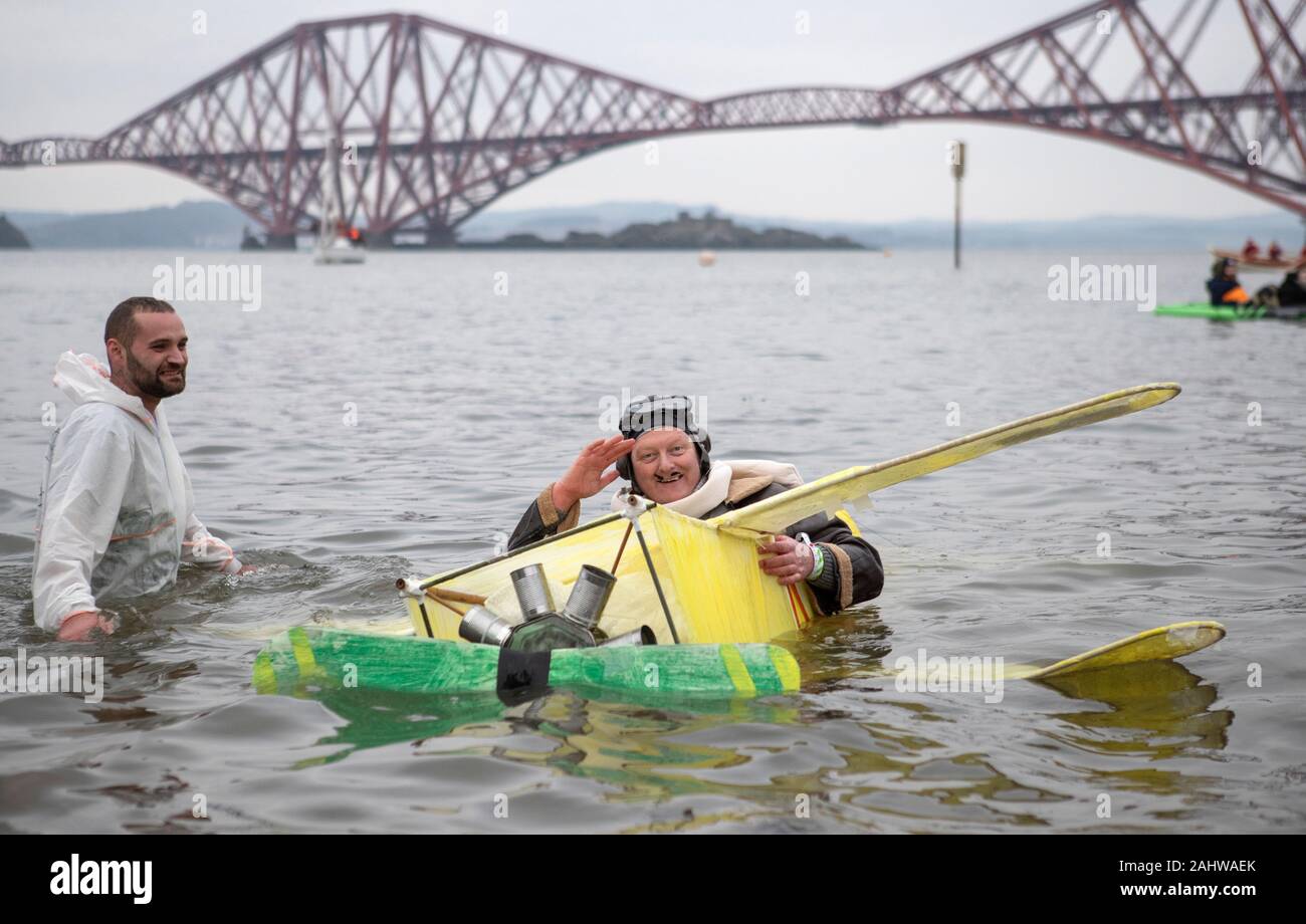 People take part in the Loony Dook New Year's Day dip in the Firth of ...