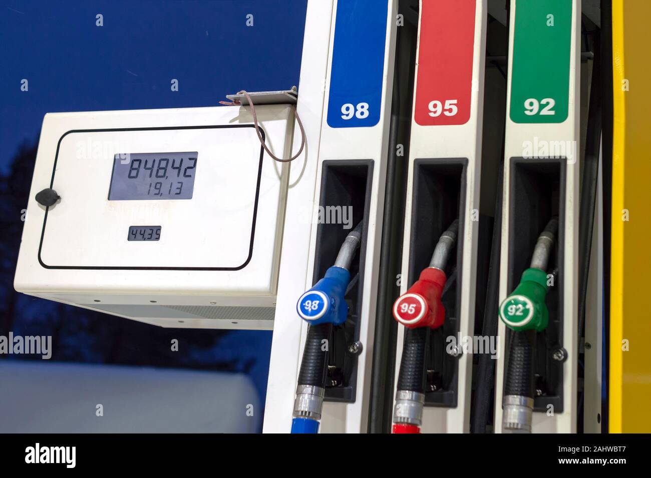Gas station column with three pistols and screen display. Side front ...
